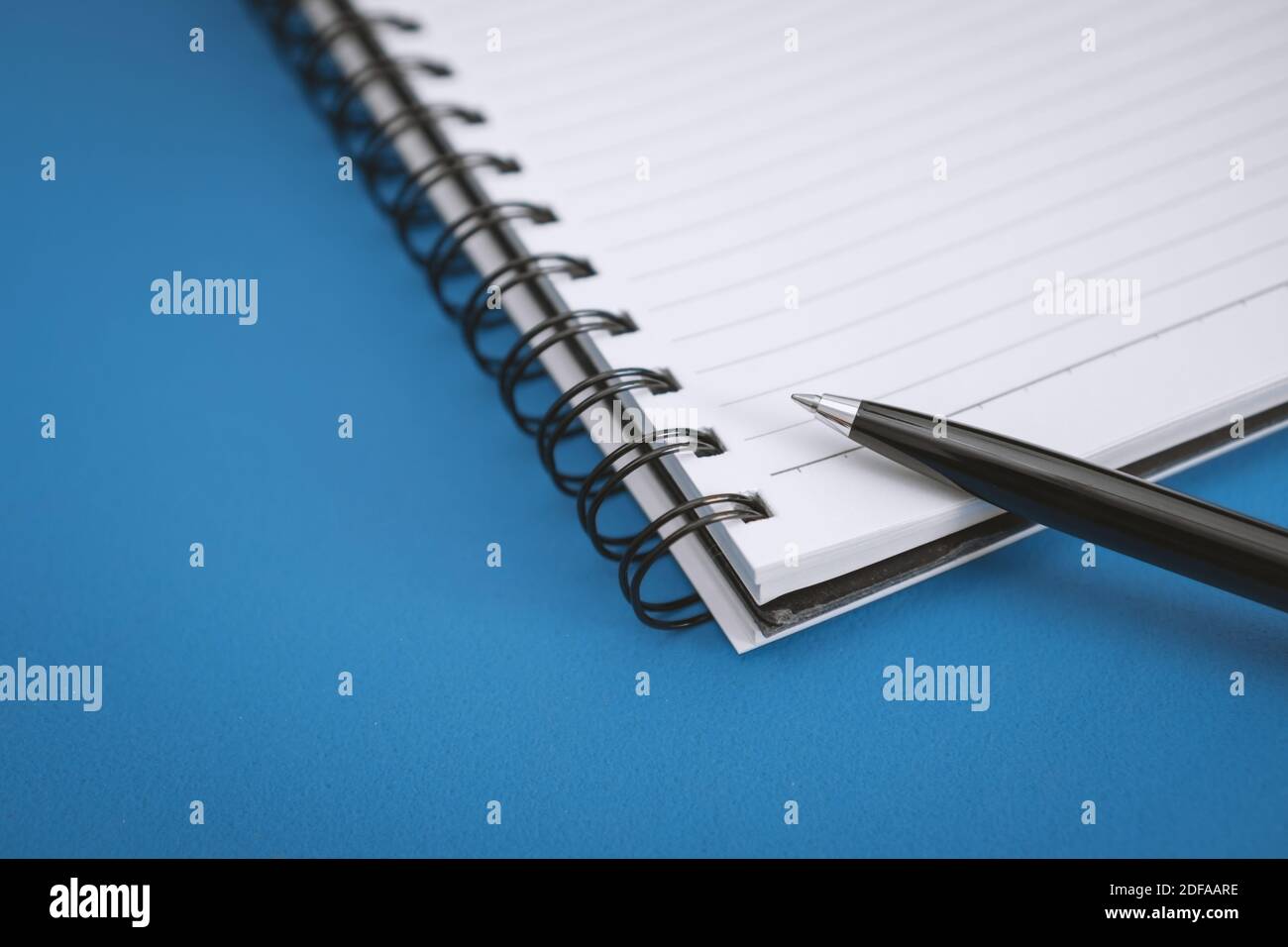 Close Up VIew of Notebook Edge and Pen Stock Photo - Alamy