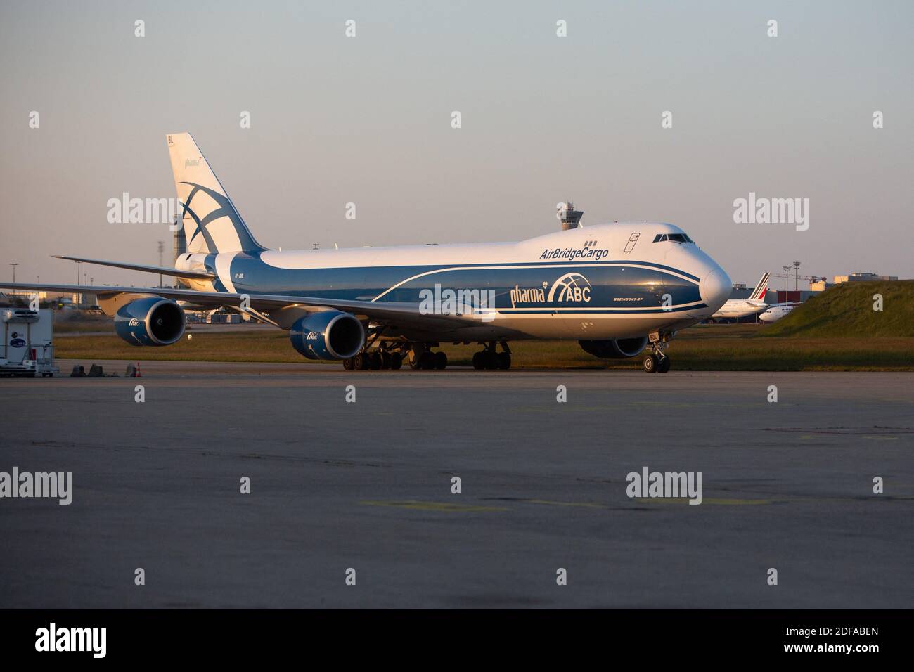 Employees of the business by air company unload a face mask supply ...
