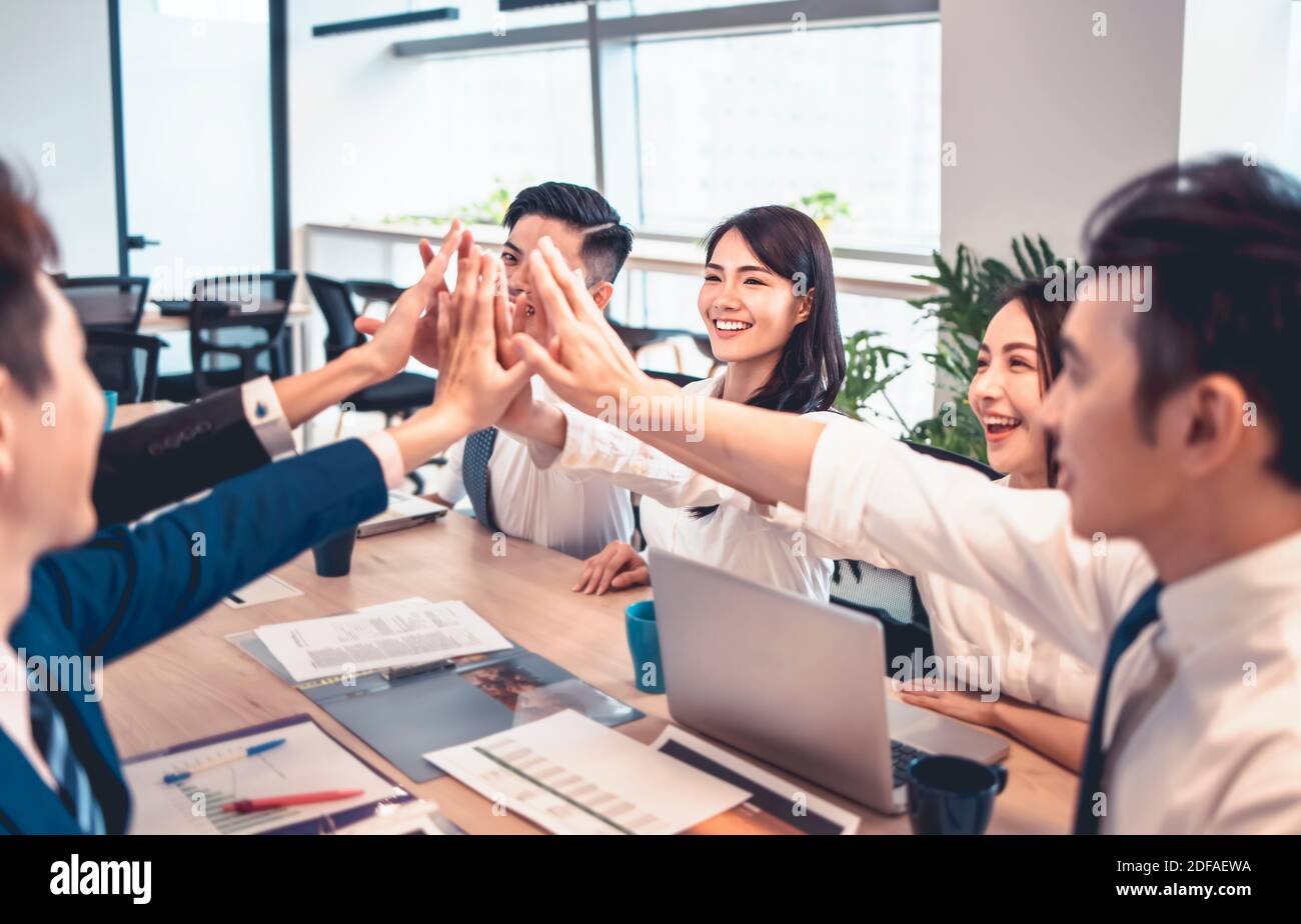 successful business team showing unity by hands Stock Photo - Alamy
