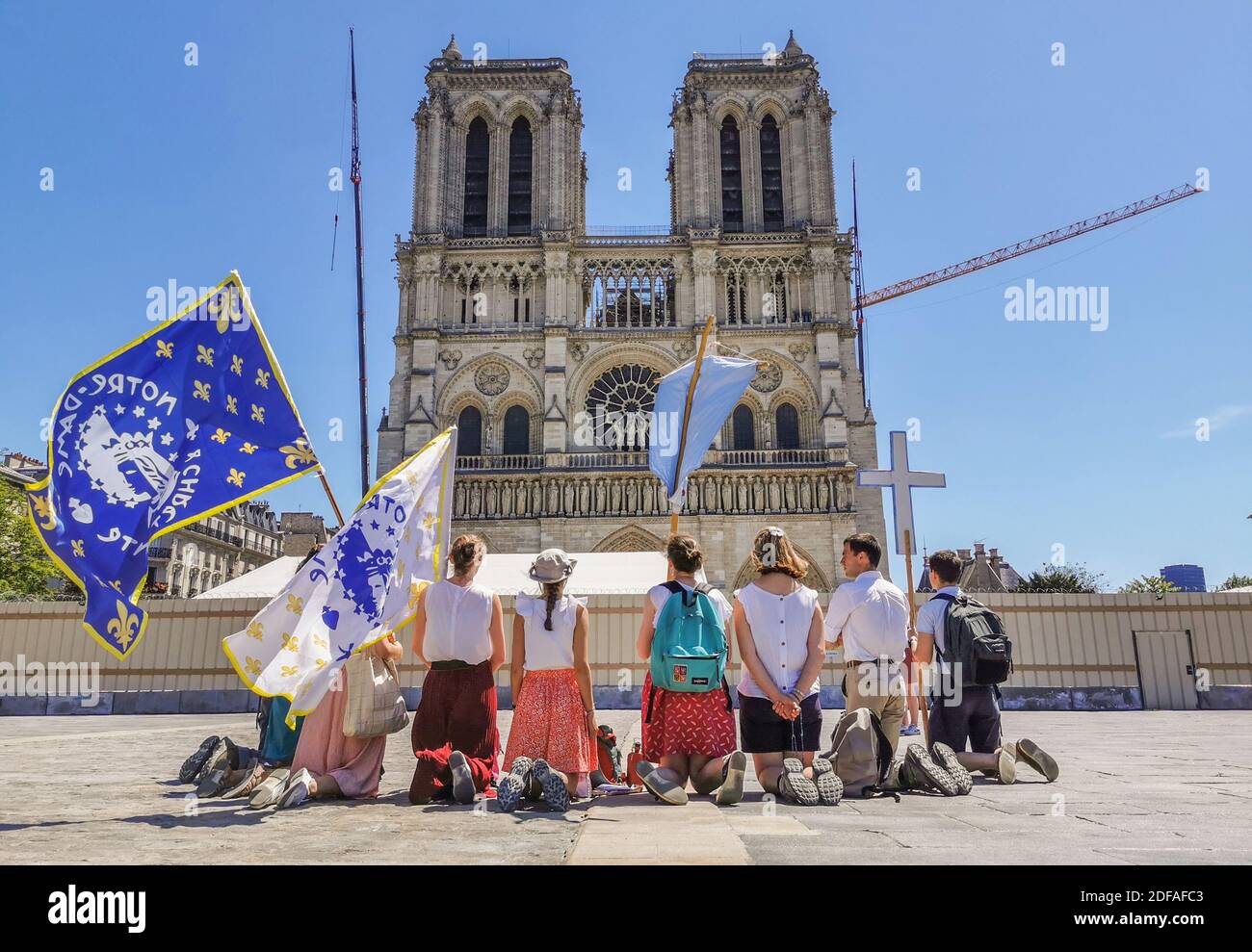 Christian faithfuls praying in front of Cathedrale Notre-Dame to ...