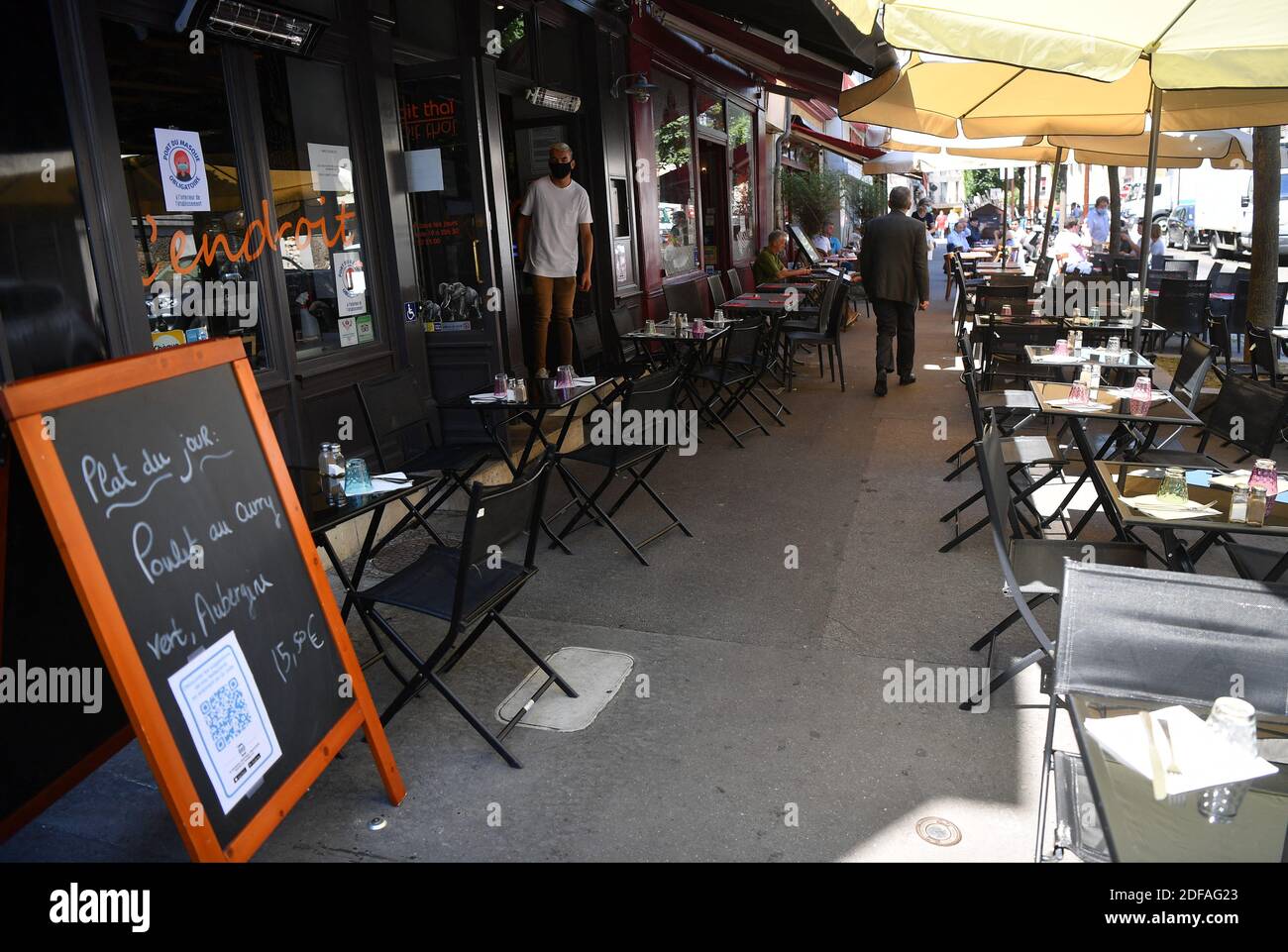 People on a terrasse of a restaurant in Versailles, as cafes and ...