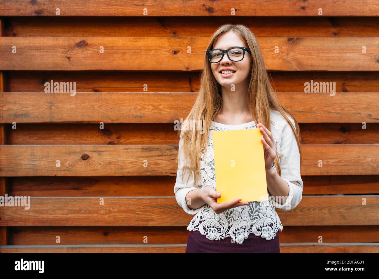 Girl reading book isolated on wooden backround. Isolated background on ...