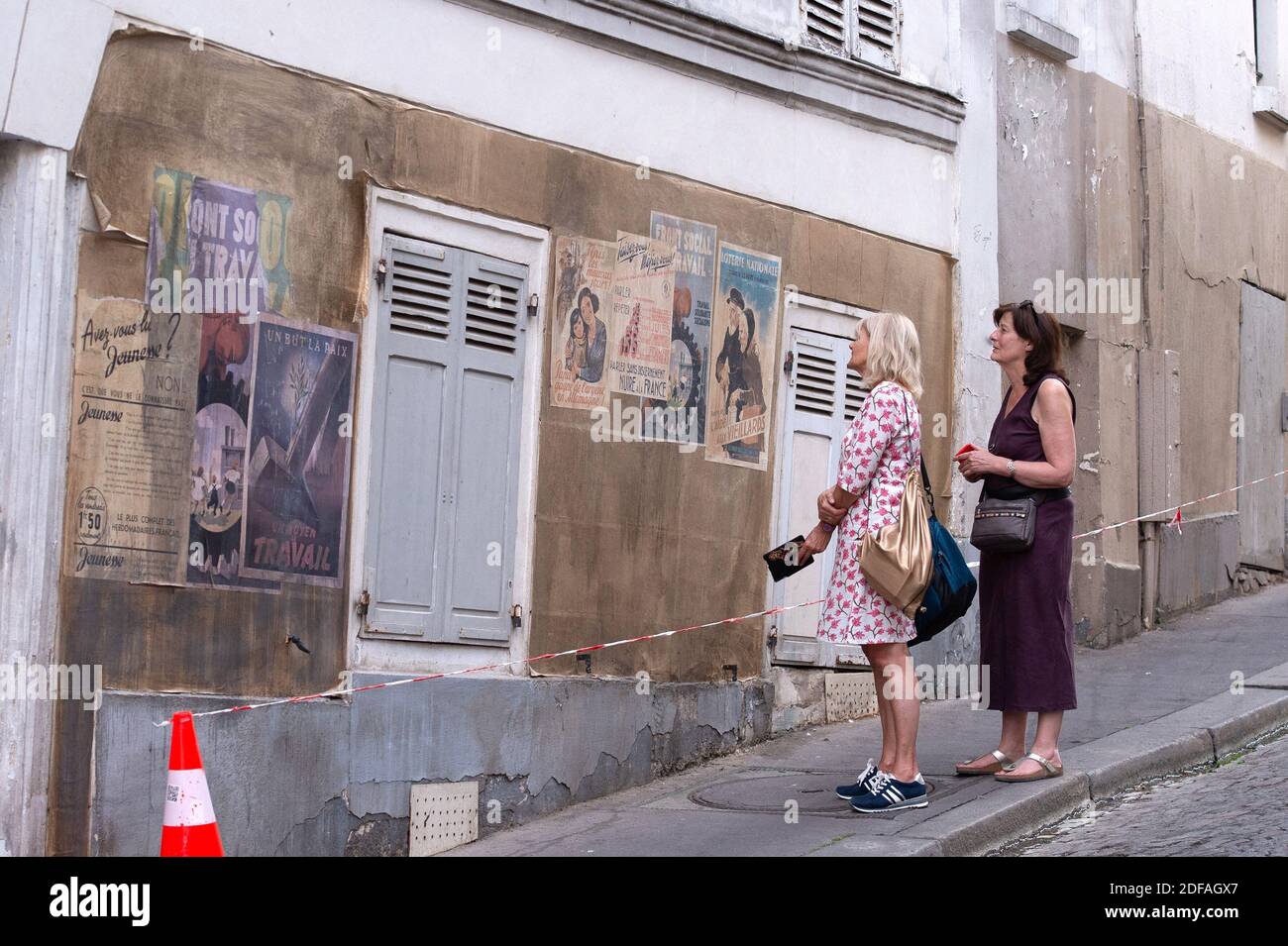People walk past the film set of 'Adieu M.Haffmann' by Fred Cavaye ...