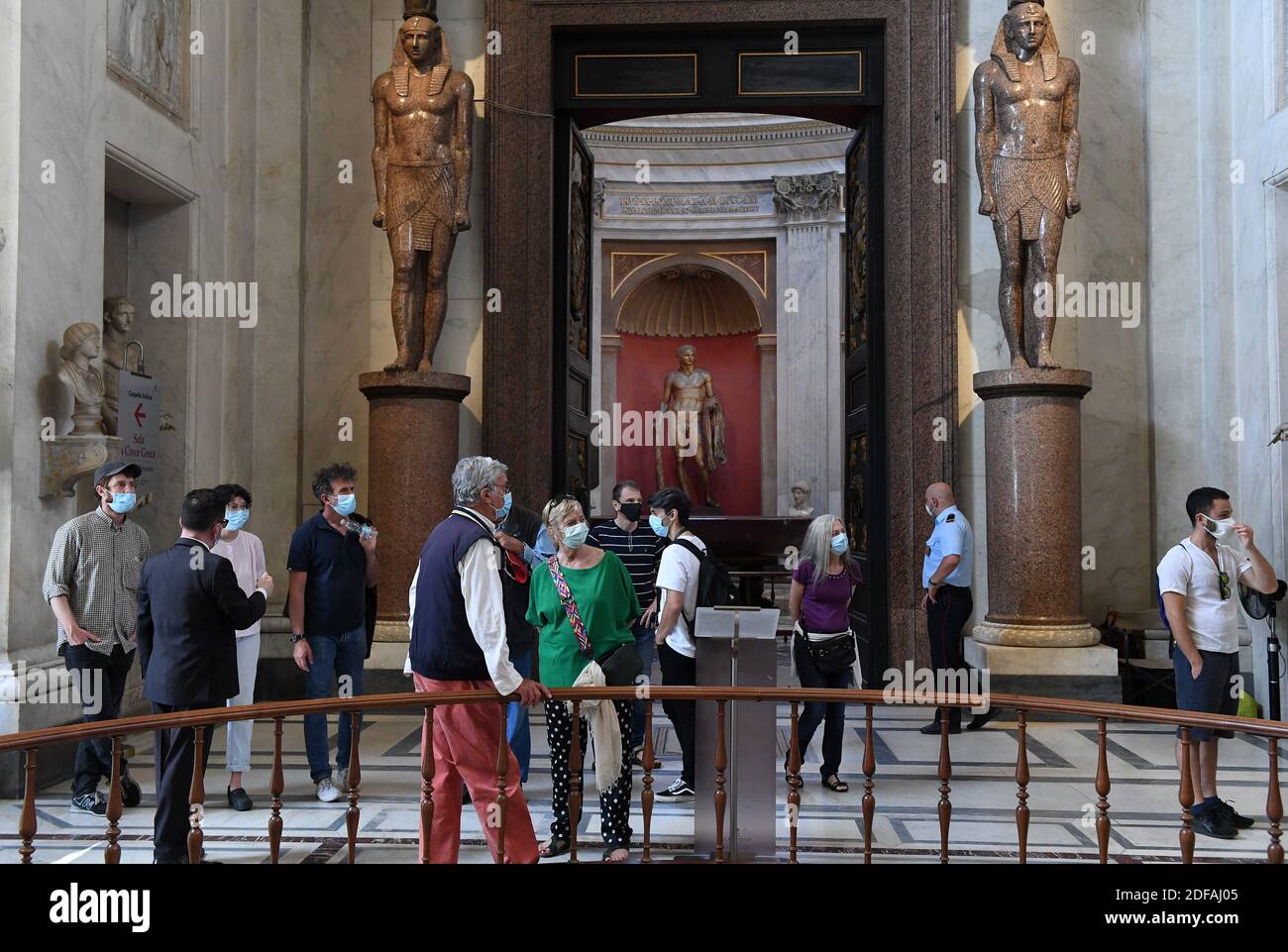 Only a few people wearing protective mask visit the Vatican Museums in ...