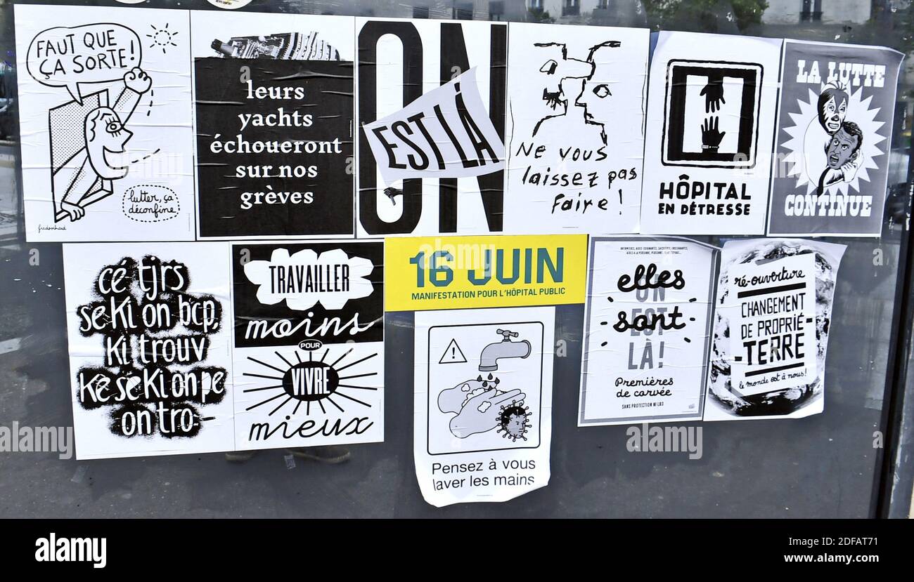 Poster stuck to the Paris wall for a demonstration for care workers on ...