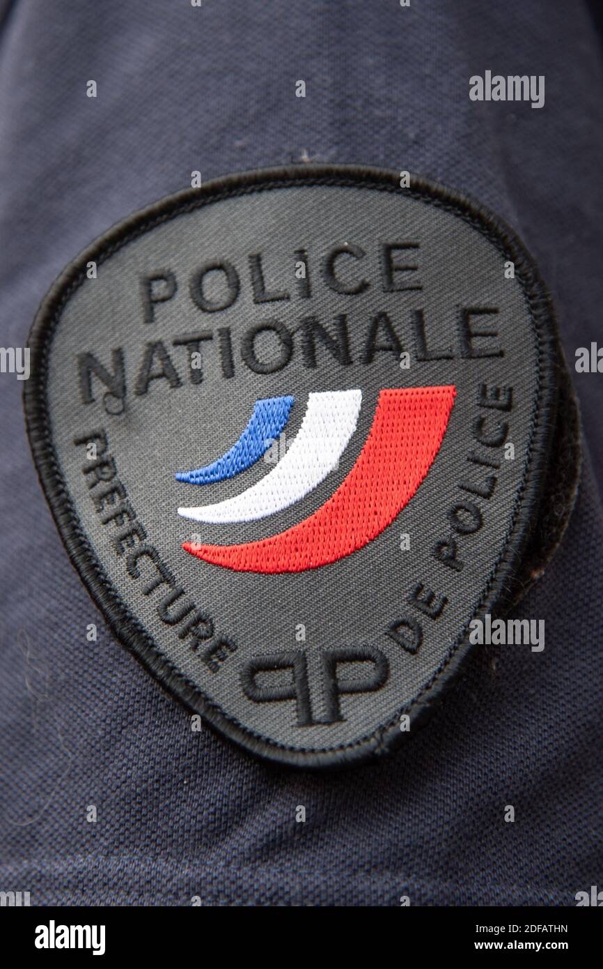 Police officers demonstrate by putting their handcuffs on the ground at ...
