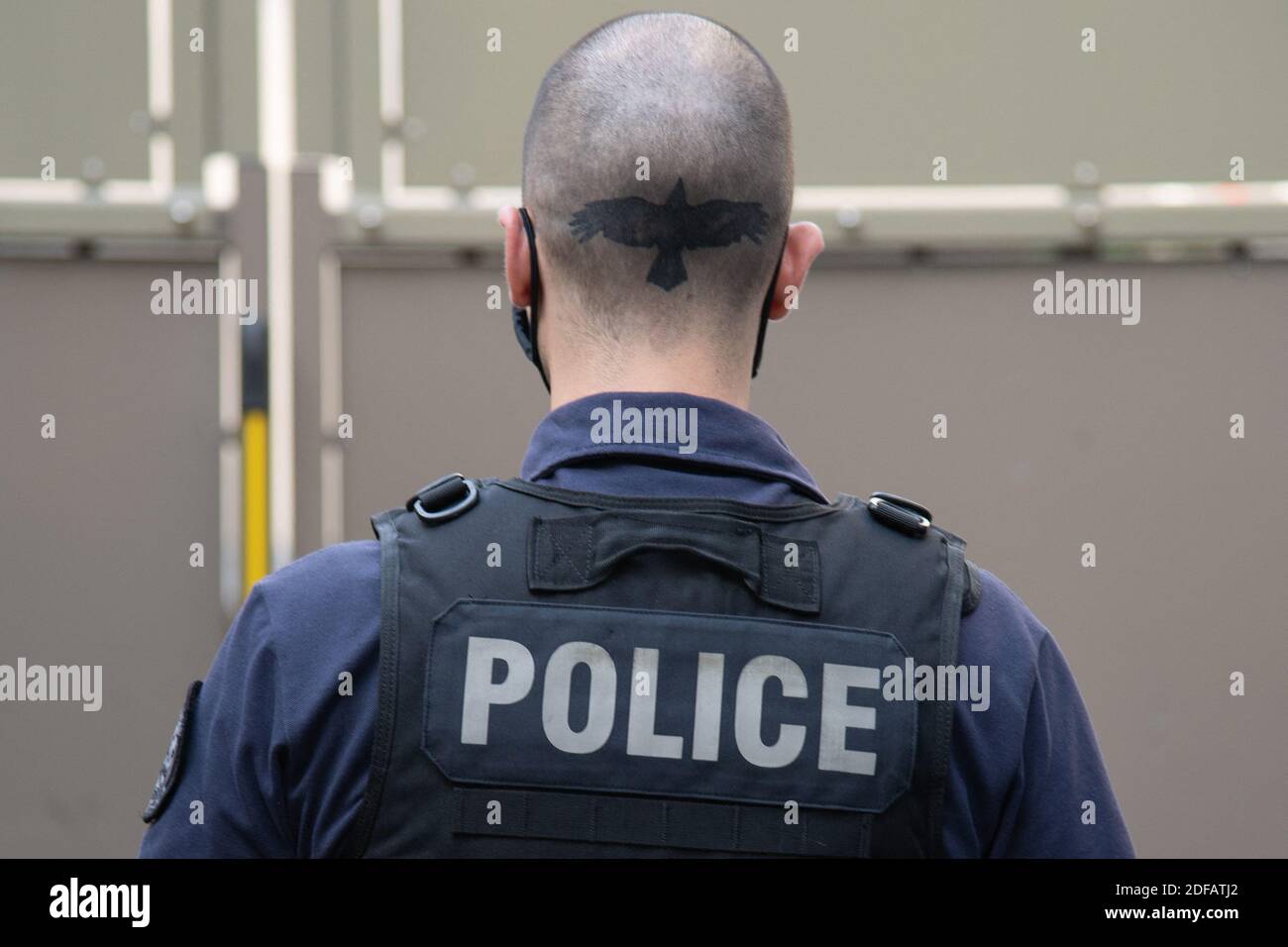 Police officers demonstrate by putting their handcuffs on the ground at ...