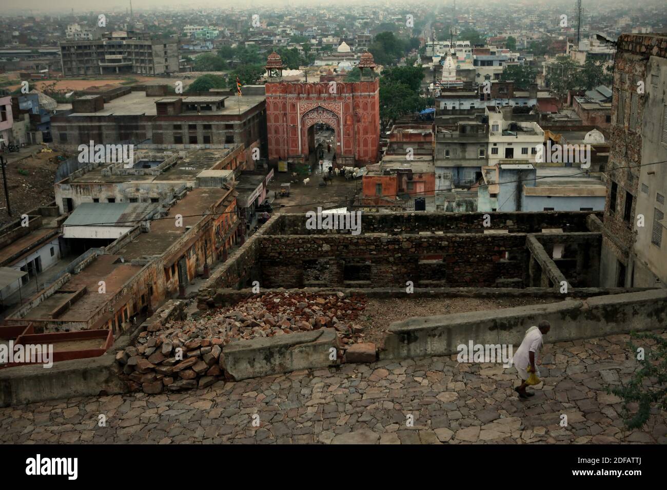 A man walking on the path leading to Surya Mandir (Sun Temple), with ...