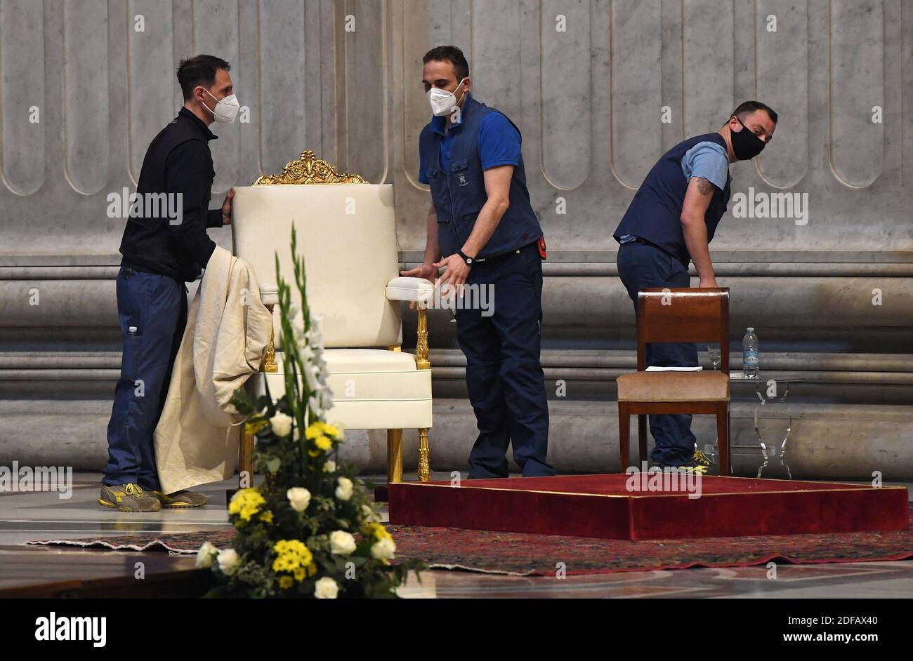 Employees of the Vatican carry the pope's throne after pope Francis ...