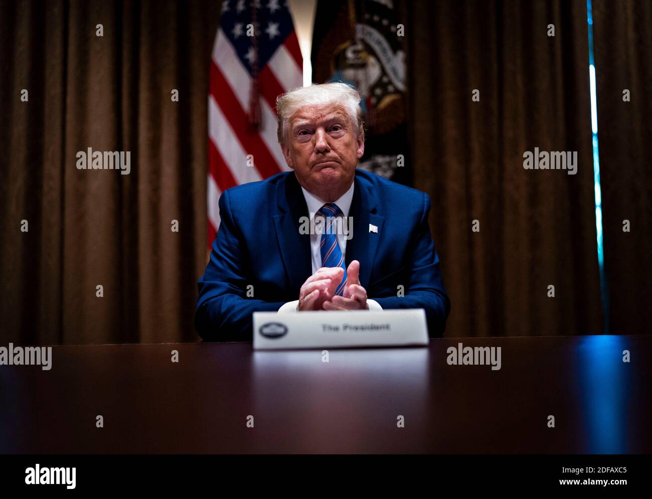 President Donald Trump makes remarks as he participates in a roundtable ...