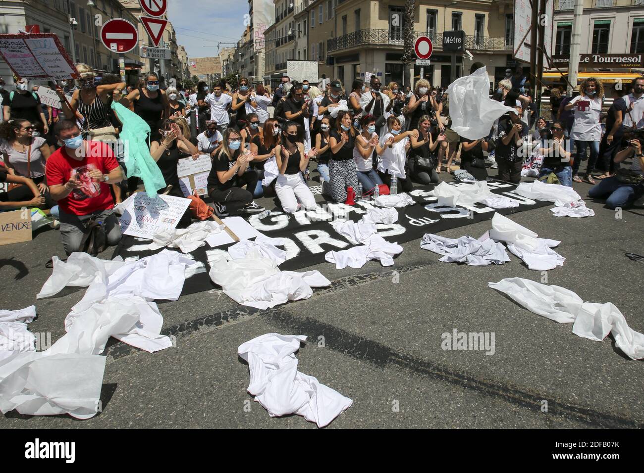 Health workers take part in a demonstration as part of a nationwide day ...