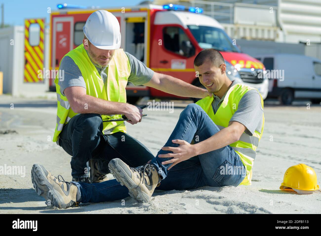 ambulance coming for the injured worker Stock Photo - Alamy