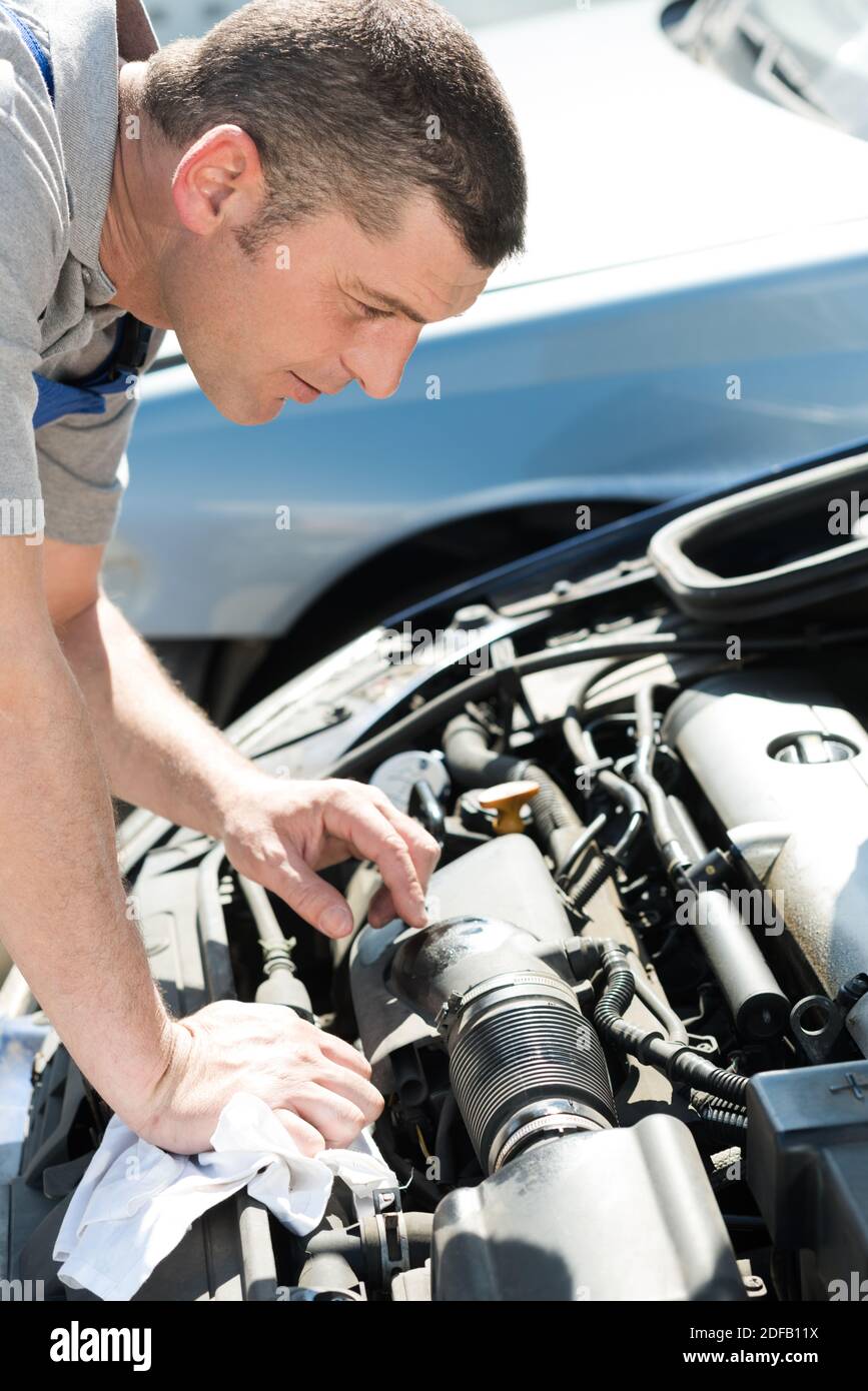 auto mechanic repairing car outdoors Stock Photo - Alamy