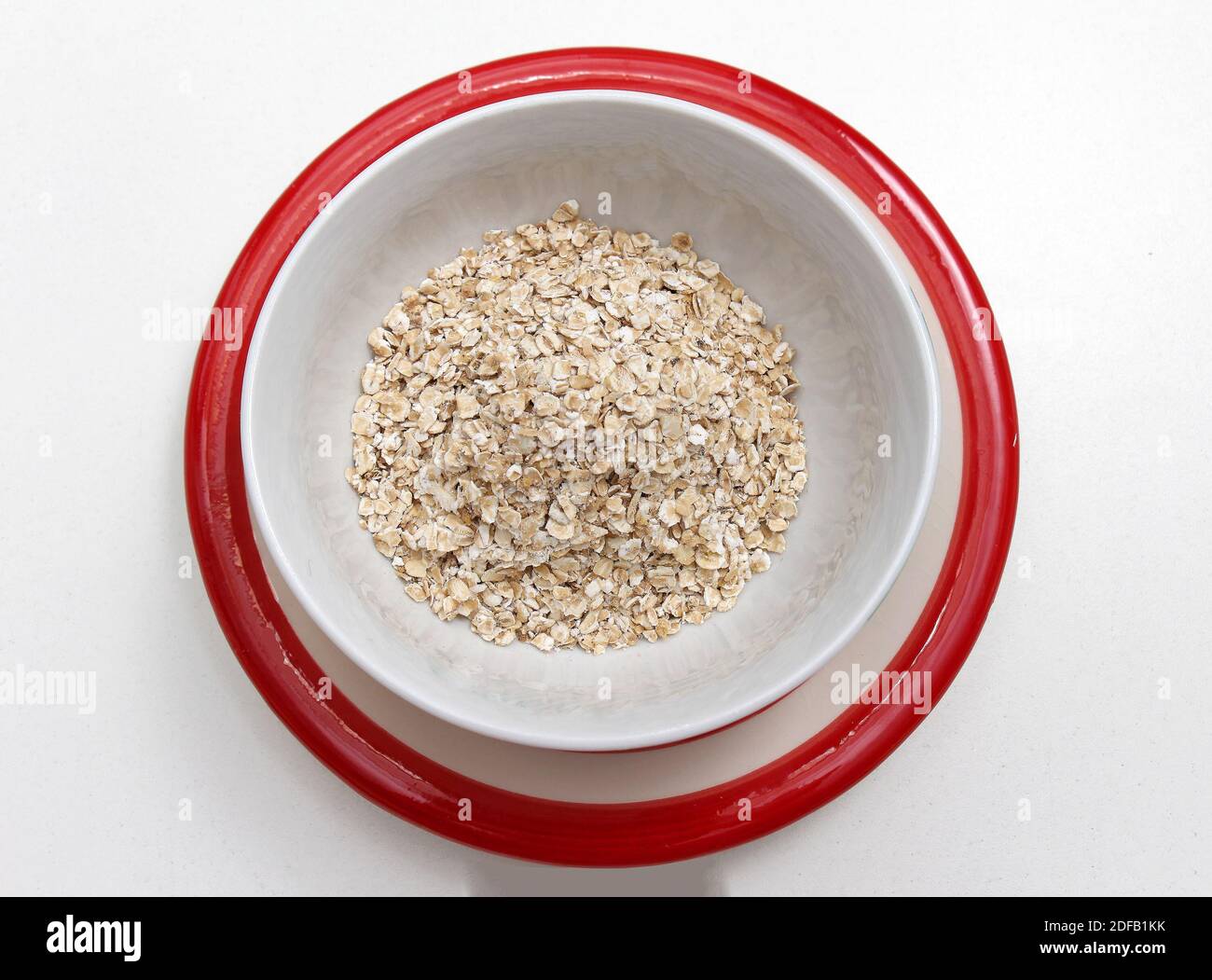 Dry organic oats flakes inside ceramic bowl on white background Stock ...