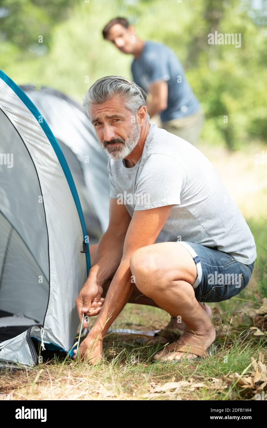 Two men setting up hi-res stock photography and images - Alamy
