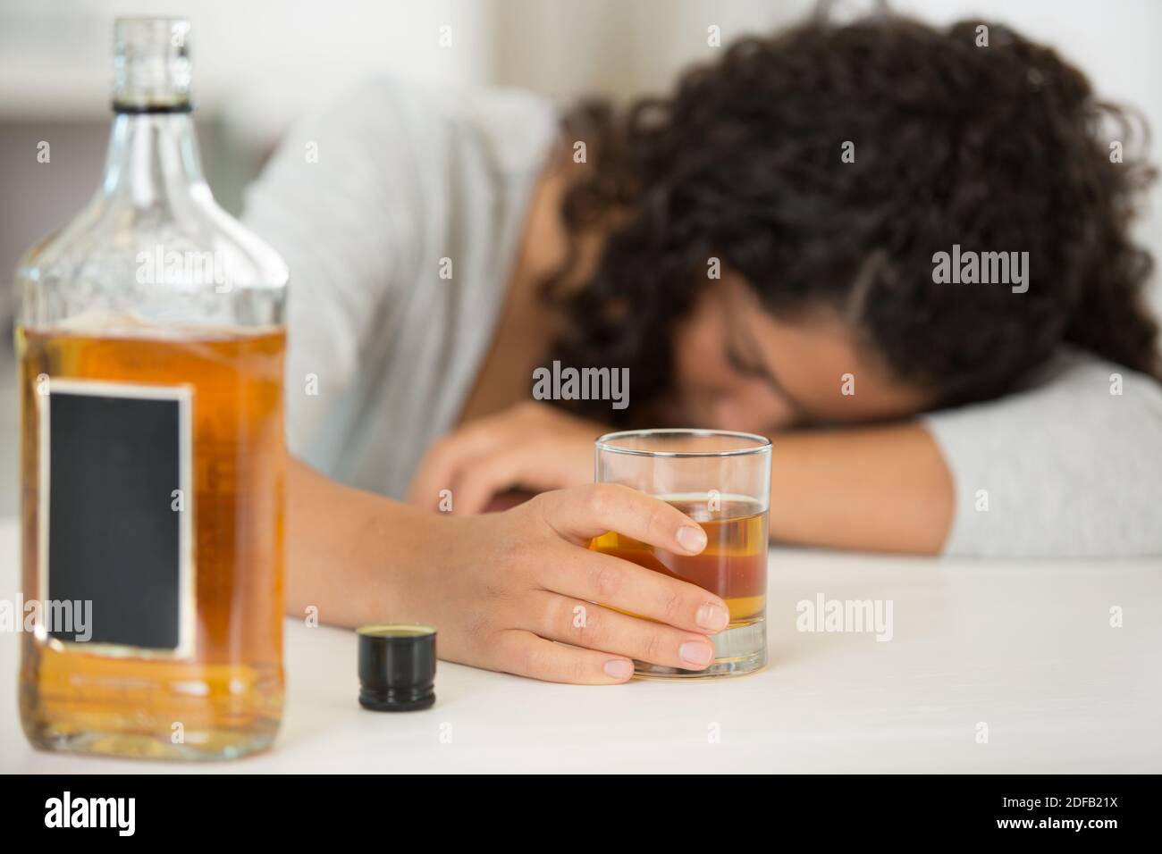 Woman slumped table hi-res stock photography and images - Alamy