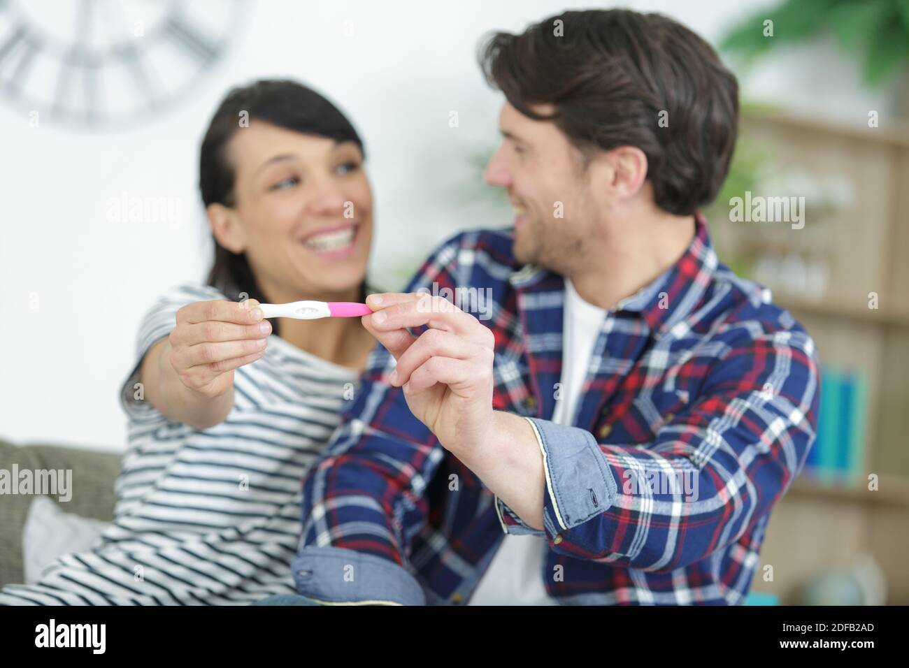 happy couple with positive pregnancy test Stock Photo - Alamy
