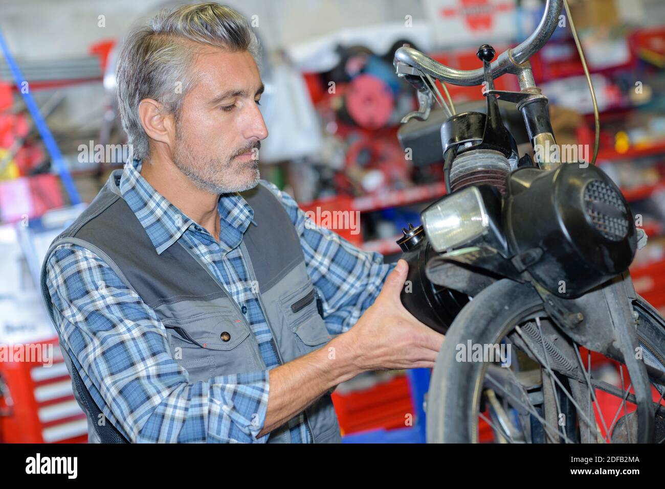 trying to solve a bike problem Stock Photo - Alamy