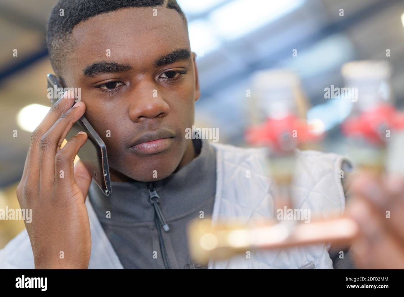 Young warehouse worker calling hi-res stock photography and images - Alamy