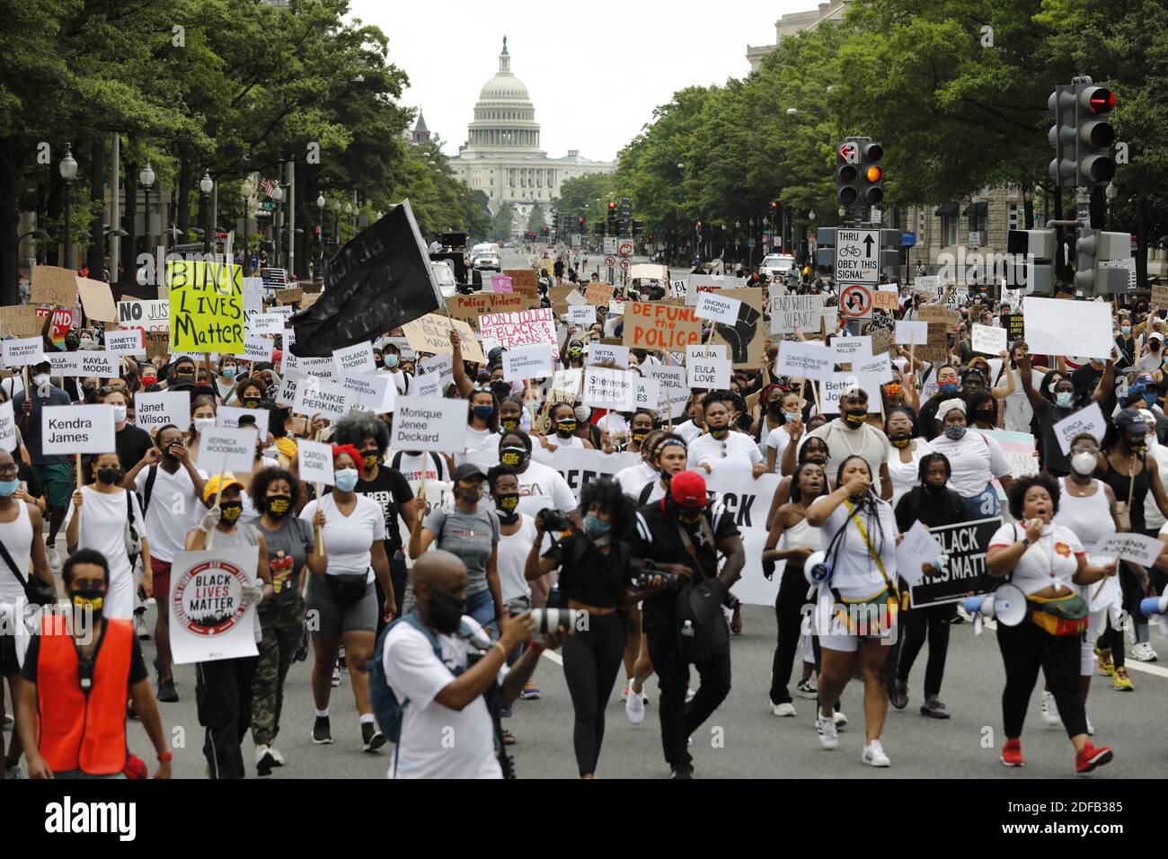 Protesters march from Capitol Hill to the major office during a rally ...