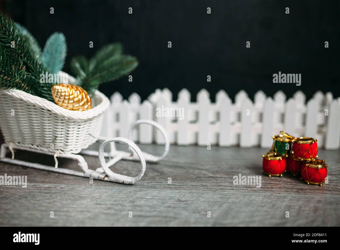 Black background. A white picket fence. Toy Santa Claus Stock Photo - Alamy