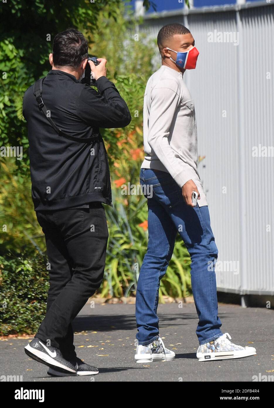 Paris Saint-Germain's French forward Kylian Mbappe arriving at the team ...