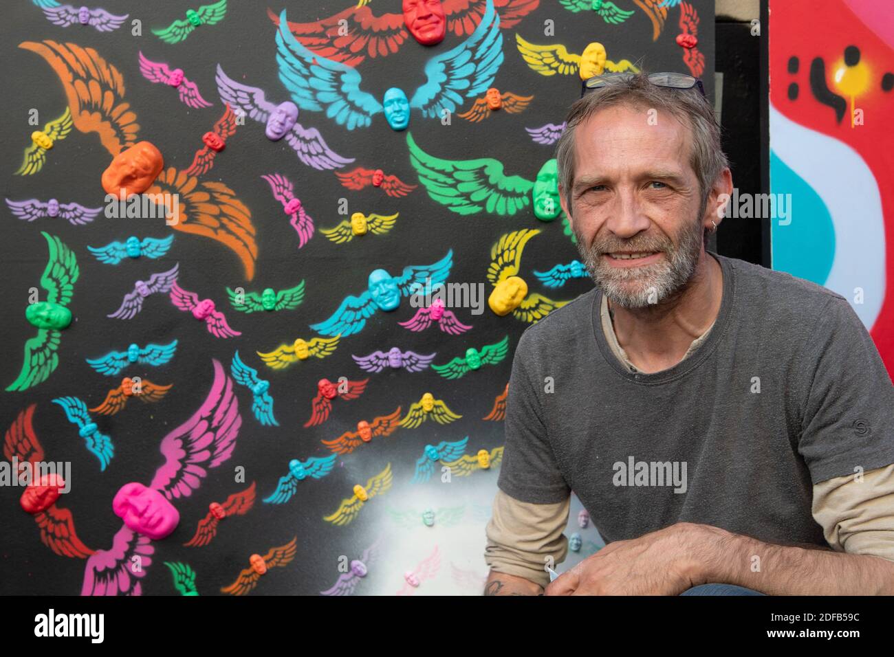Street artist Gregos is seen as a street art performance takes place to ...