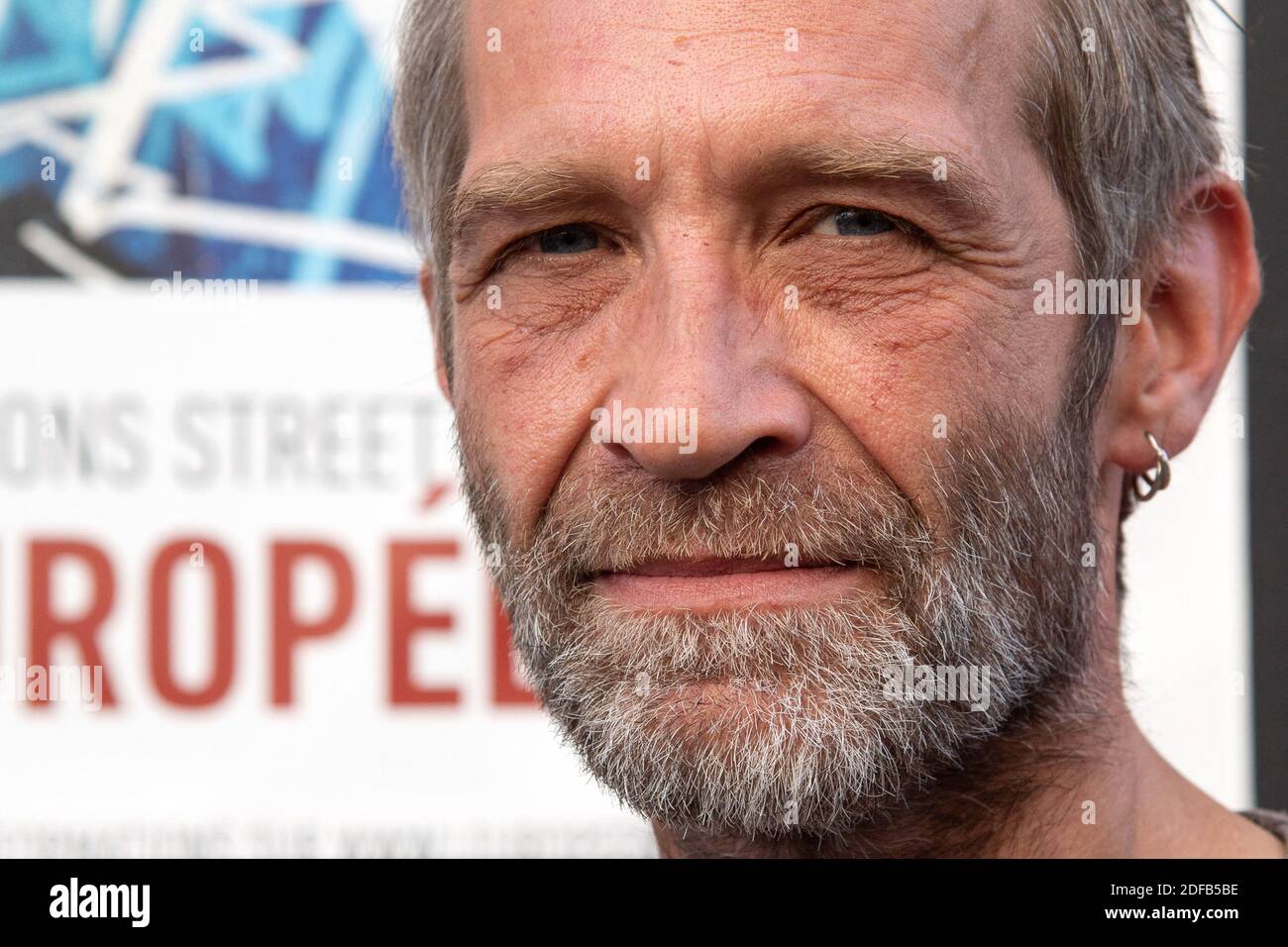 Street artist Gregos is seen as a street art performance takes place to ...