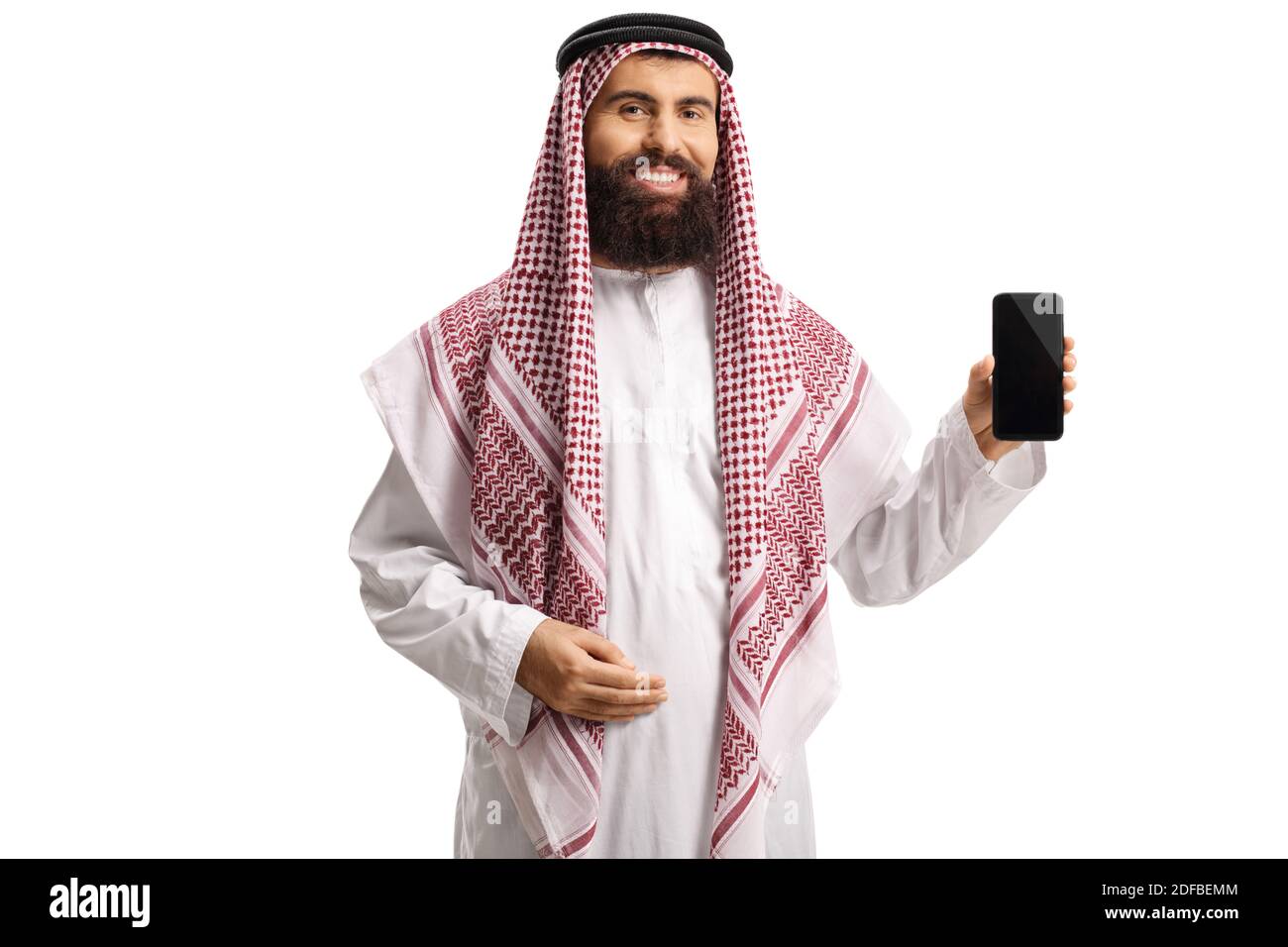 Arab man in a thobe holding a smartphone isolated on white background ...