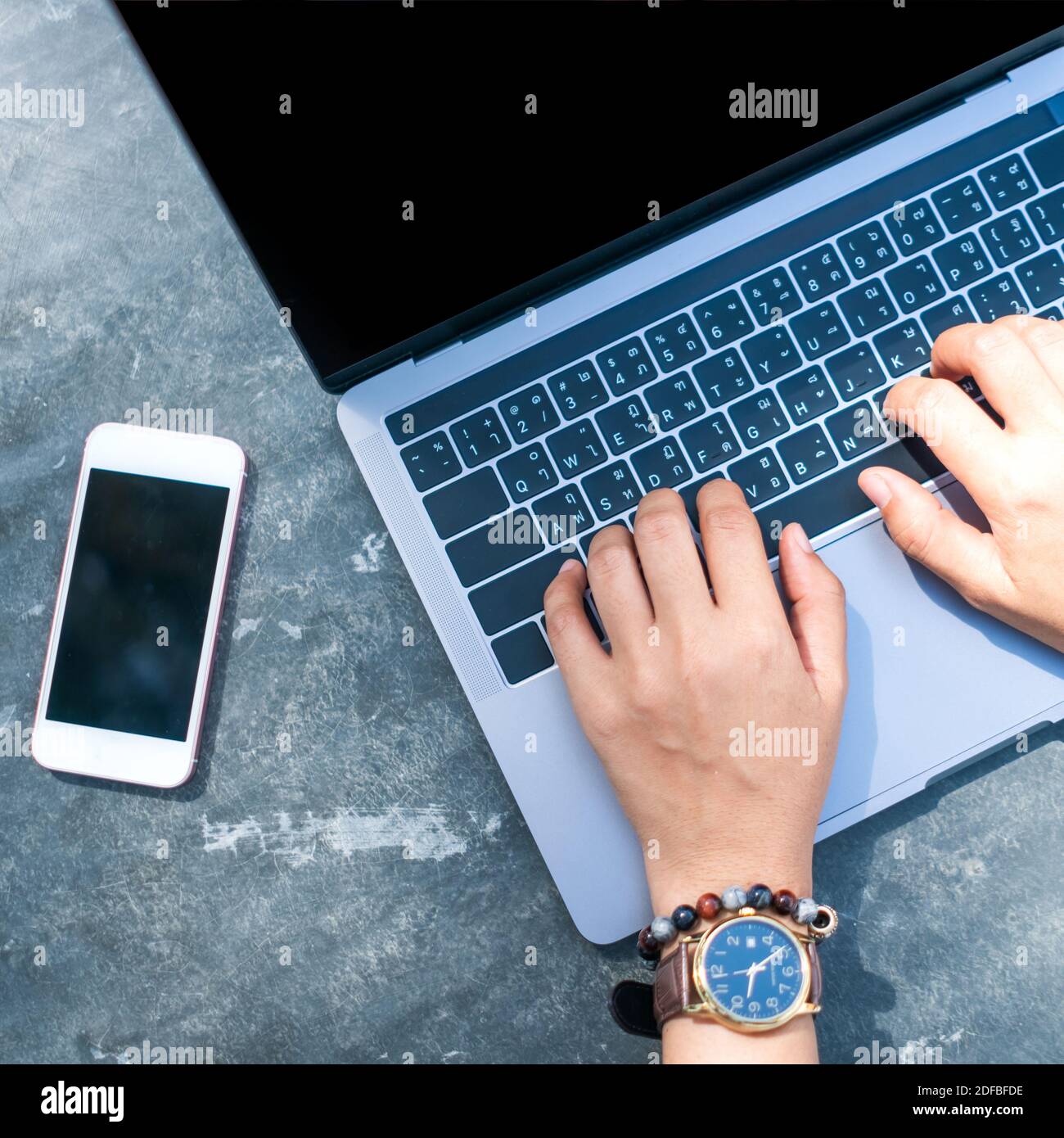 Woman using laptop and smartphone to work study in vacation cady at ...