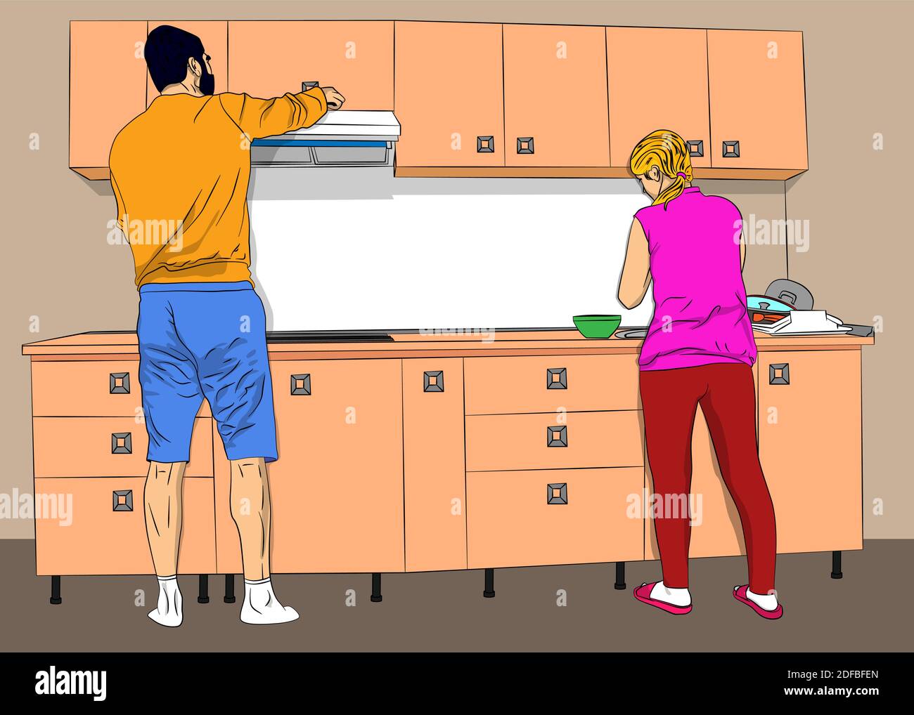 Young couple working in kitchen. Viewed from back. Man in the kitchen ...