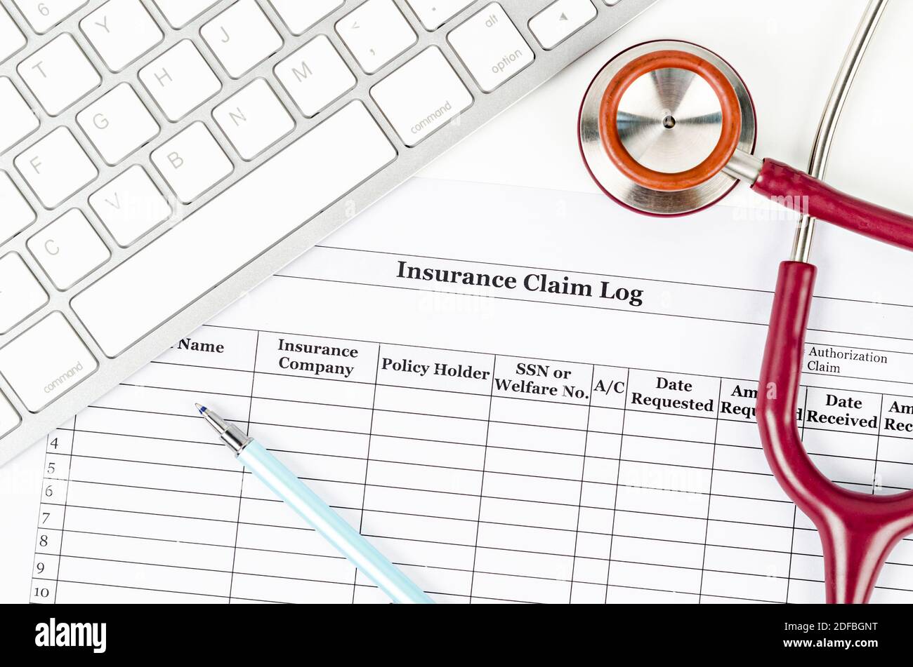 Medical insurance claim log form and stethoscope and keyboard computer ...