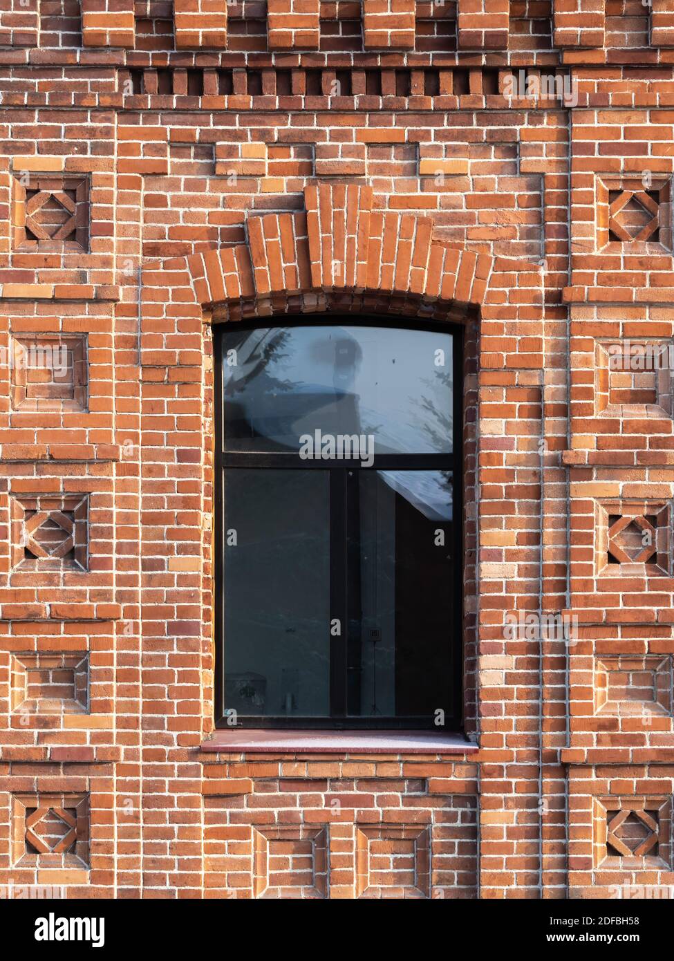 The window of the old mansion 19 century with brown bricks wall. Brick ...