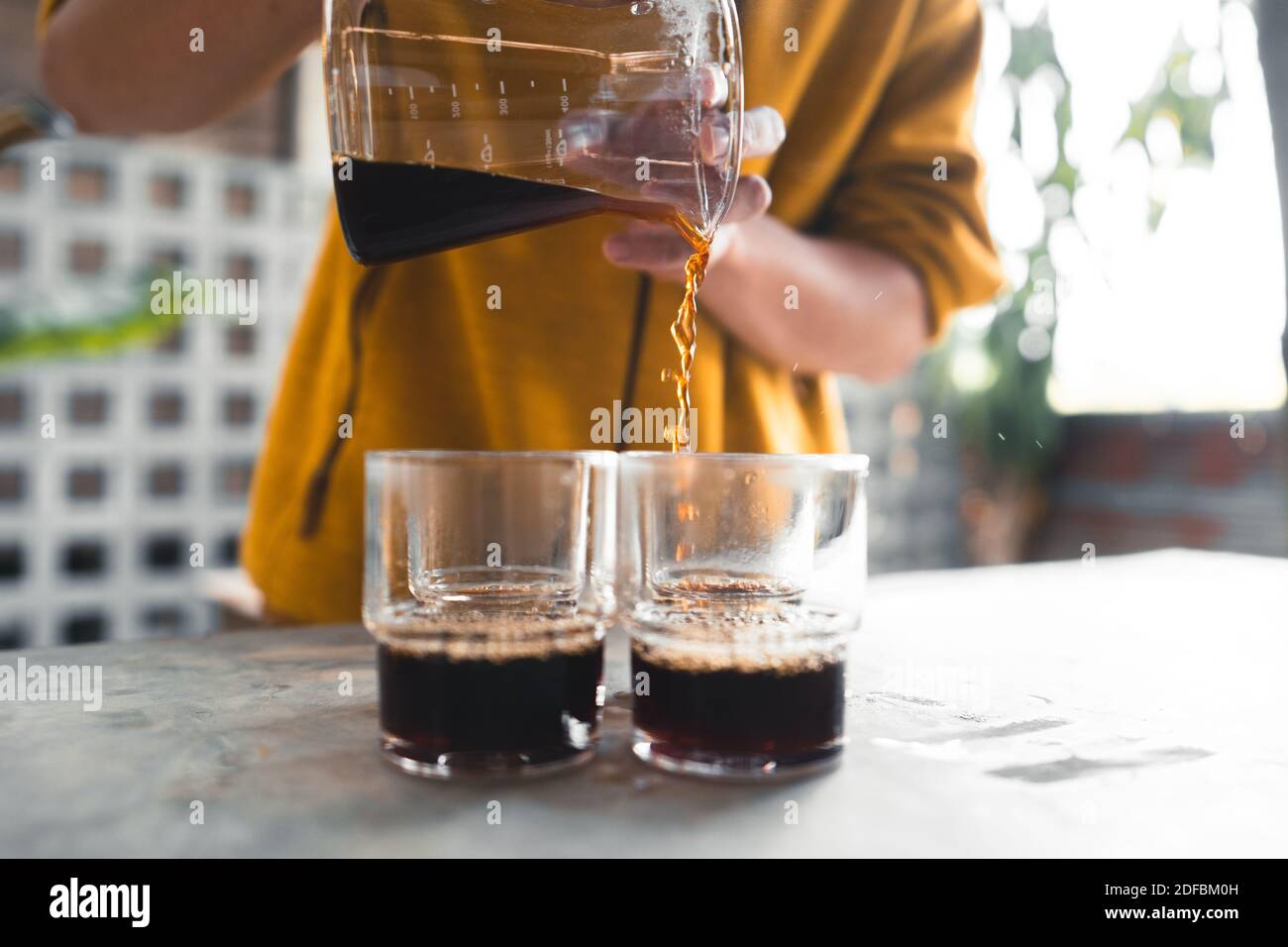 Drip coffee, barista pouring water on coffee ground with filter,brewing ...
