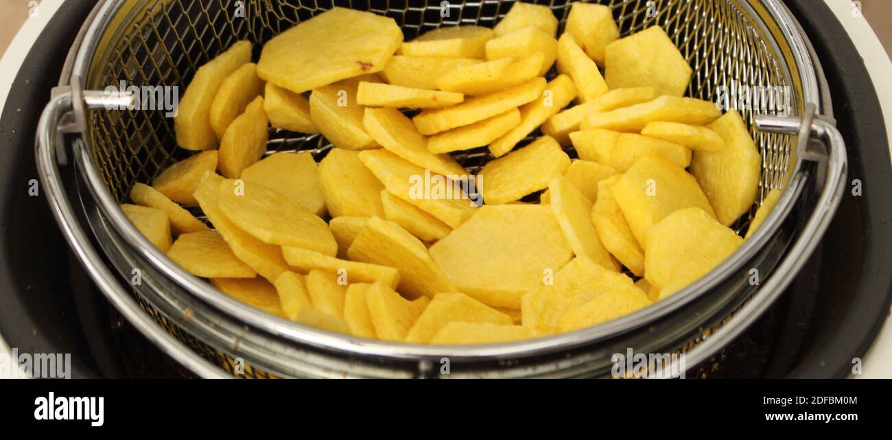 fresh crispy french fries from the deep fryer Stock Photo - Alamy