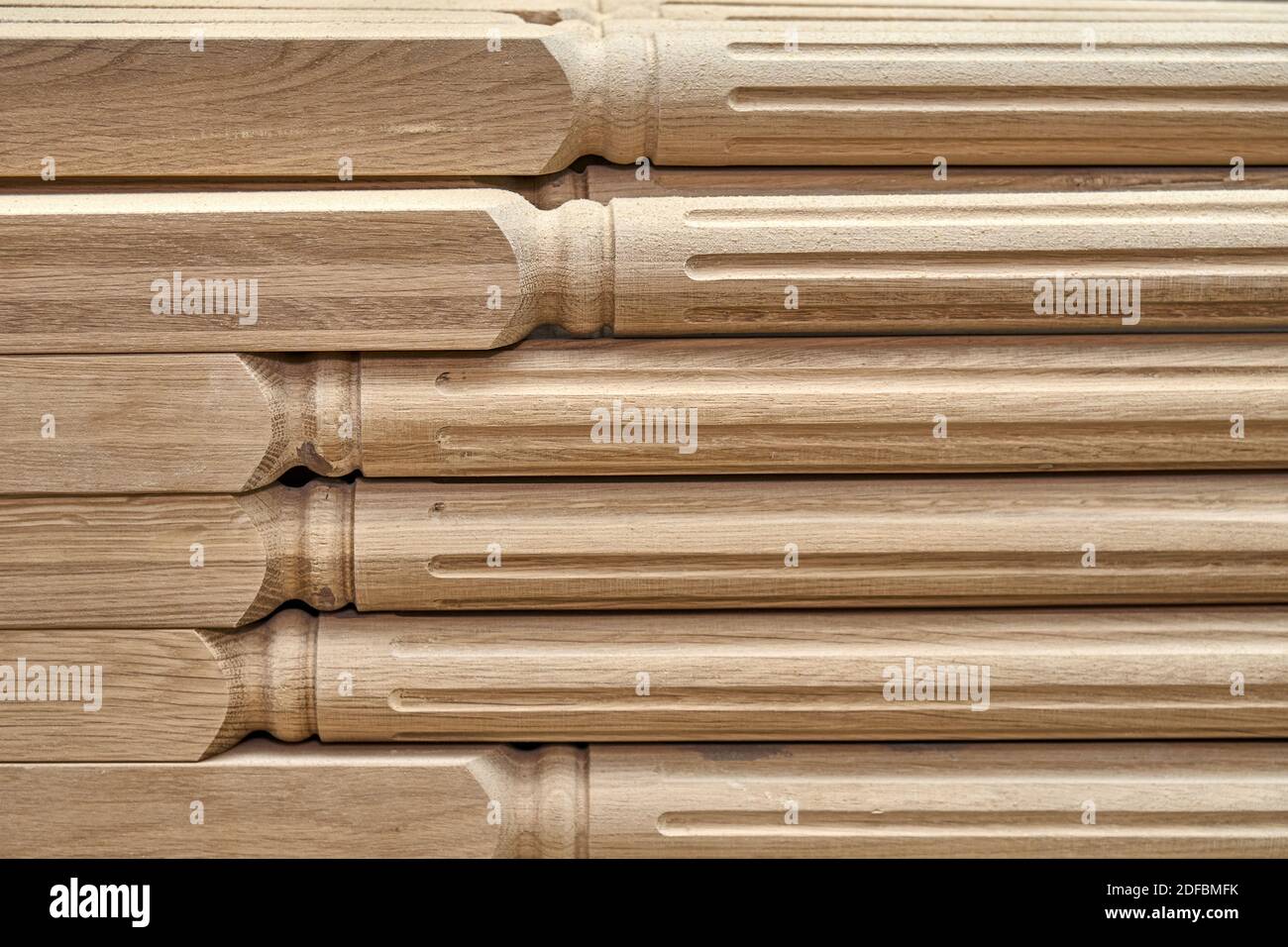 Turning wooden stair balusters. Wood stair balusters stacked after ...