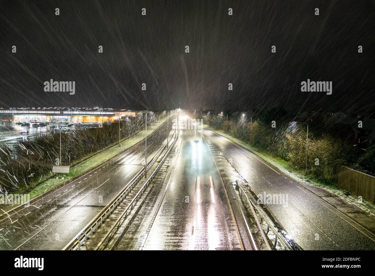 Overhead view of traffic driving at night on the major road, A299 ...