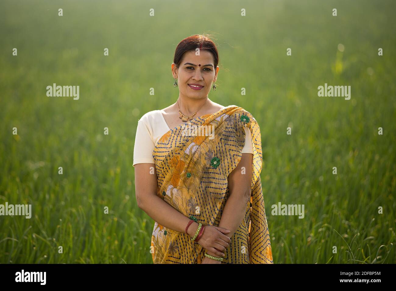 Beautiful woman farmer standing hi-res stock photography and images - Alamy