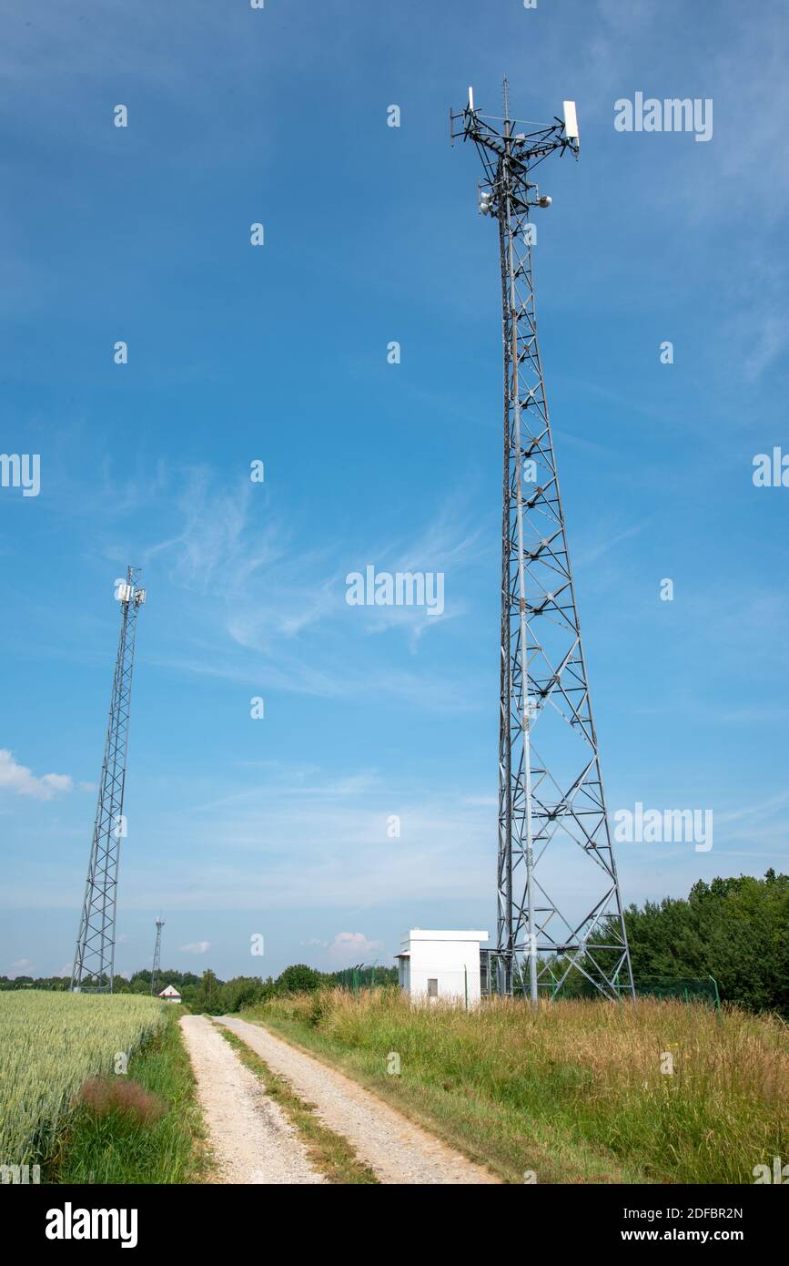 Country road to telecommunication cell tower Stock Photo - Alamy