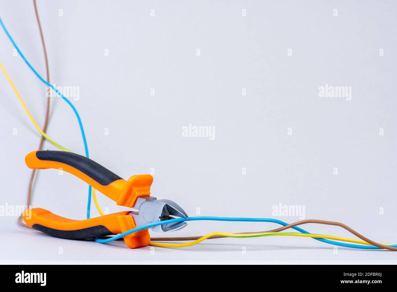 Tool pliers with electrical cable Stock Photo - Alamy