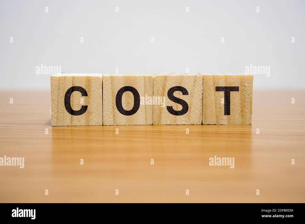 Wooden cube block cost hi-res stock photography and images - Alamy