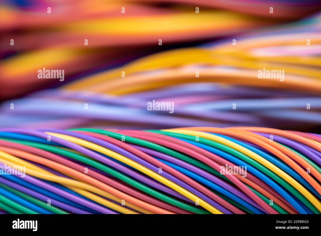 Multicolored electrical computer cable installation Stock Photo - Alamy