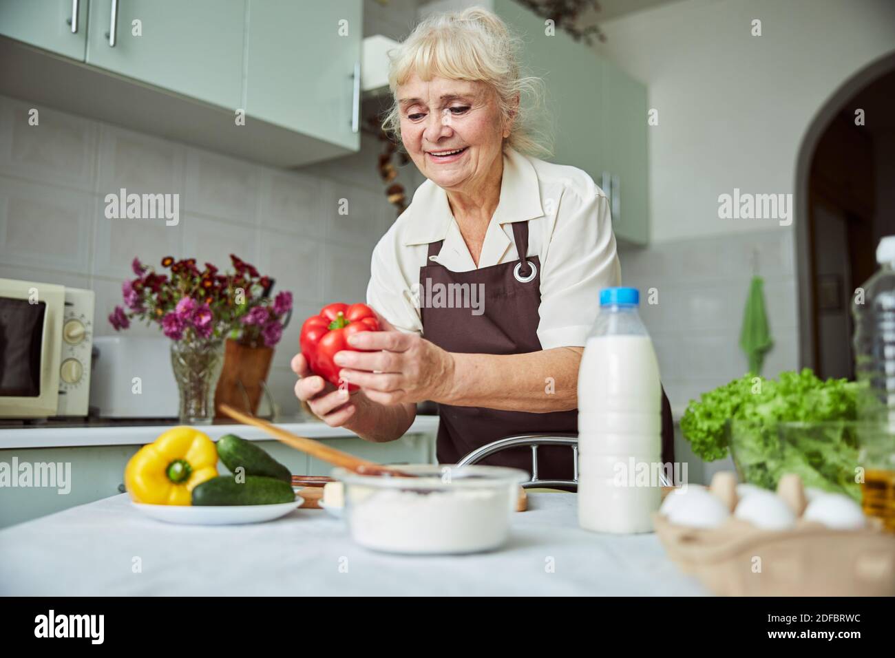 Old woman cook hi-res stock photography and images - Alamy