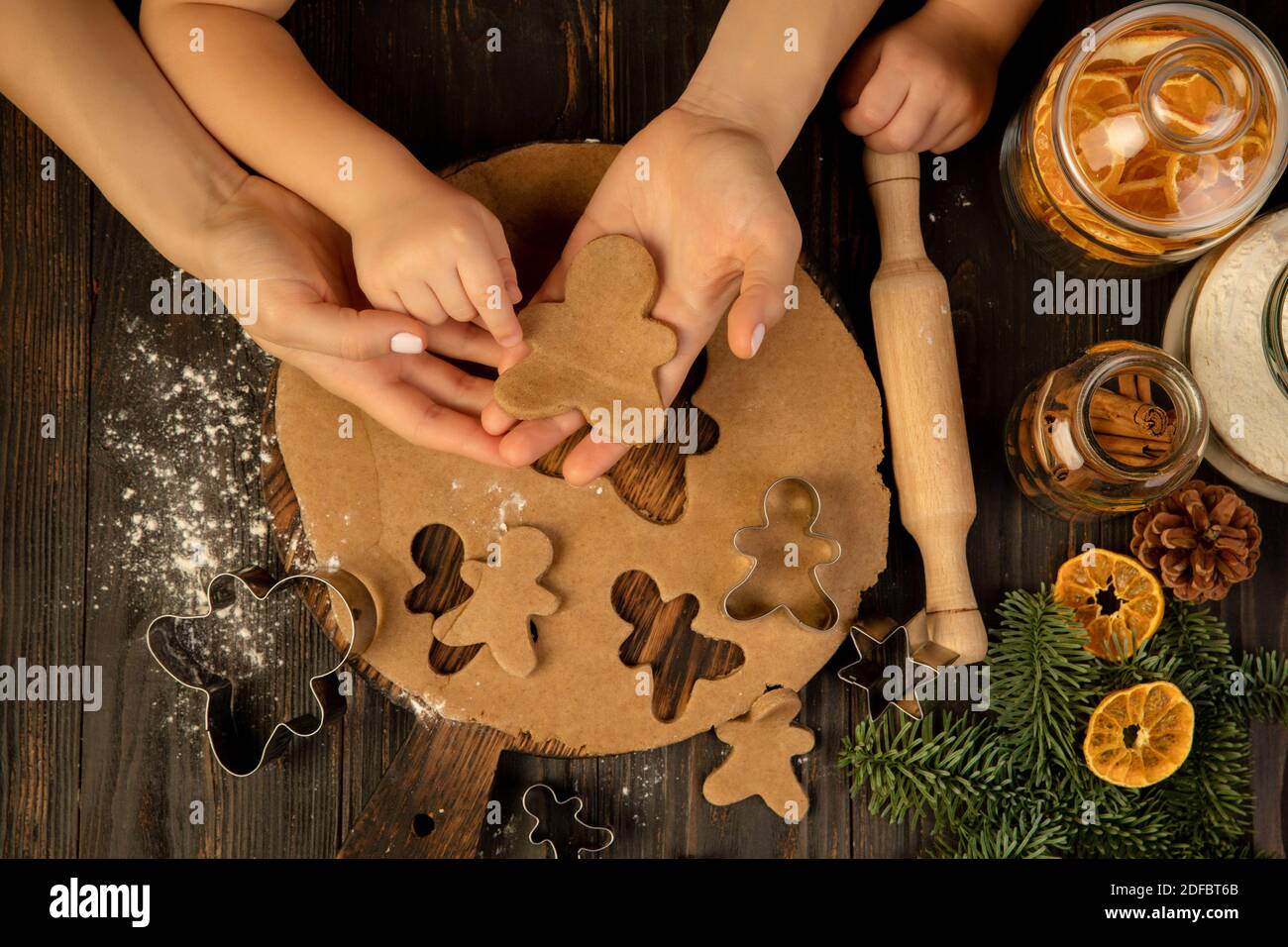 Christmas gingerbread man in child hands. Holiday, family, home comfort ...