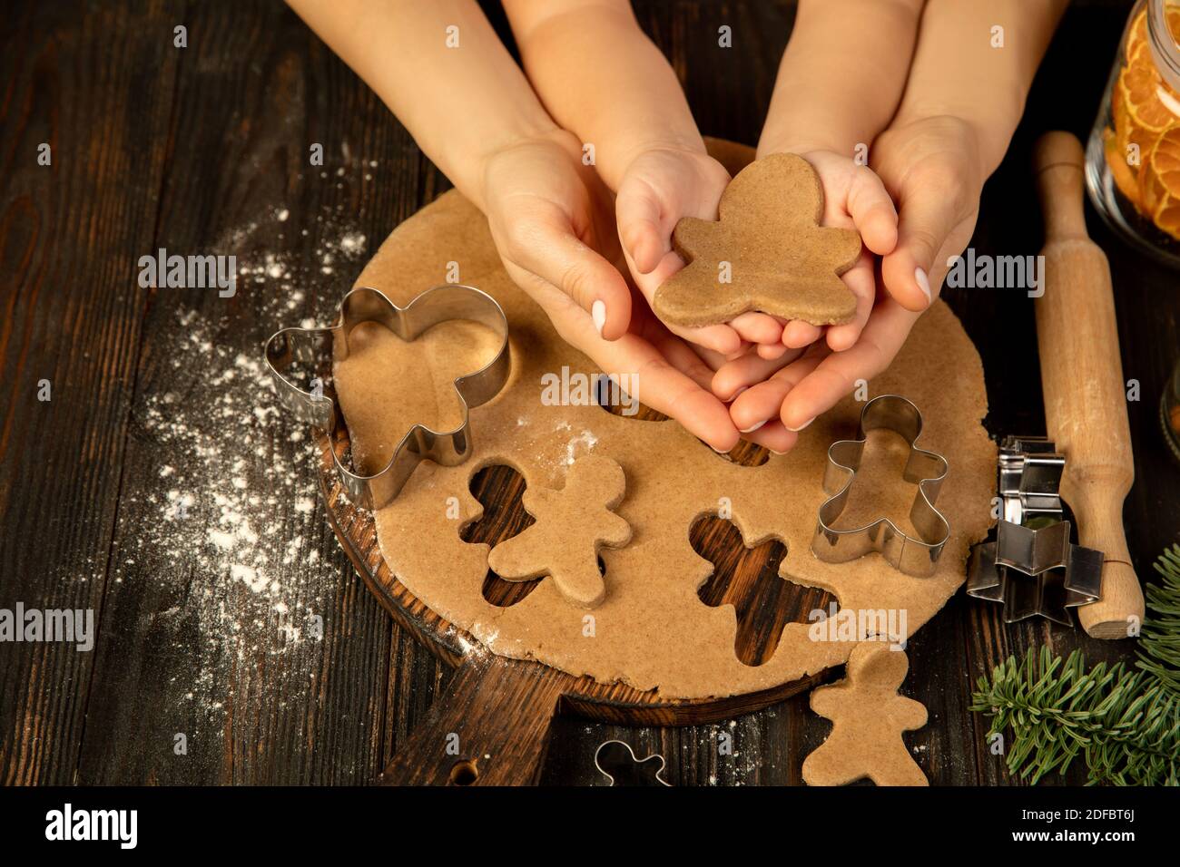 Christmas gingerbread man in child hands. Holiday, family, home comfort ...