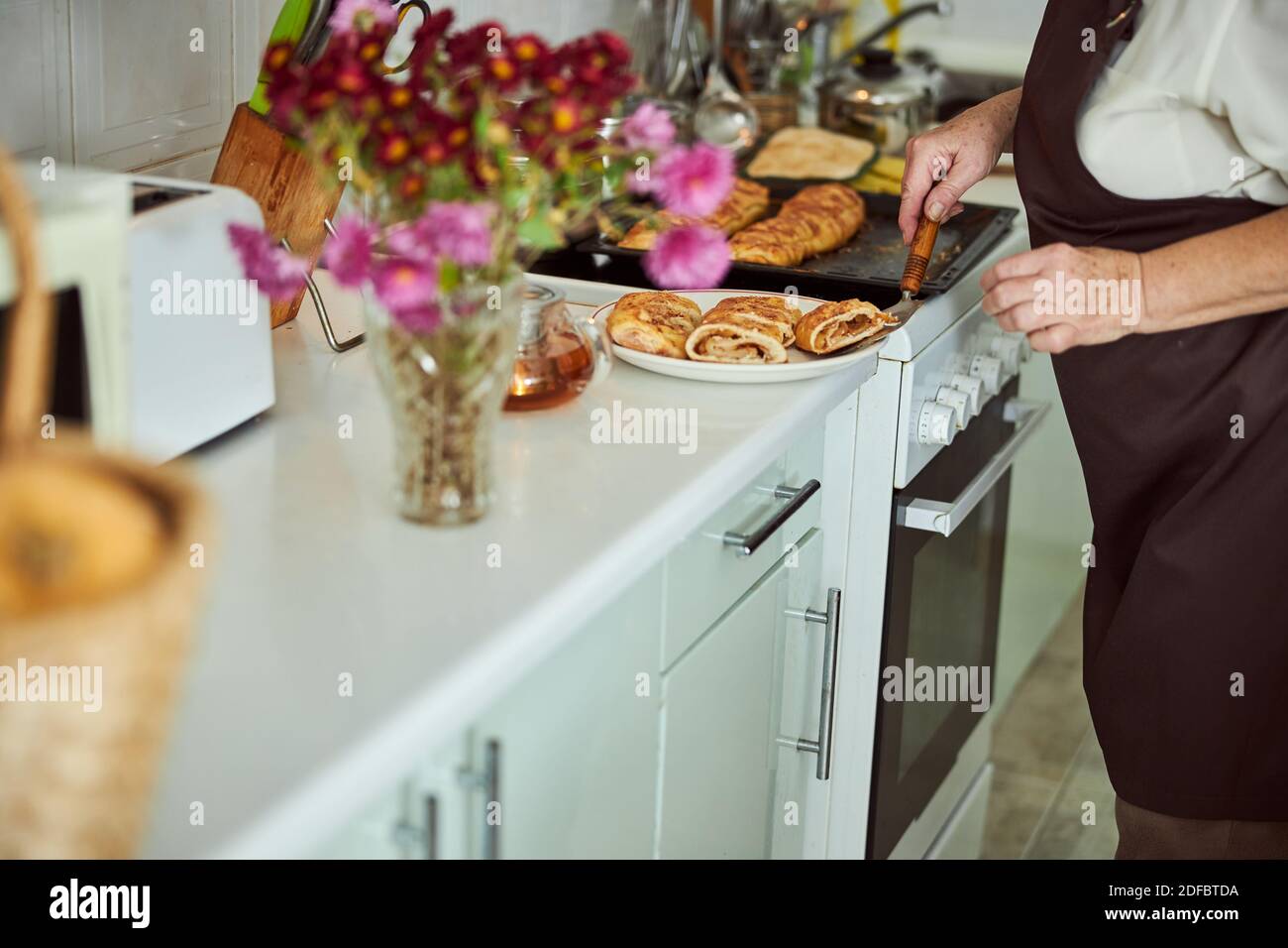 Woman placing food on plate hi-res stock photography and images - Alamy