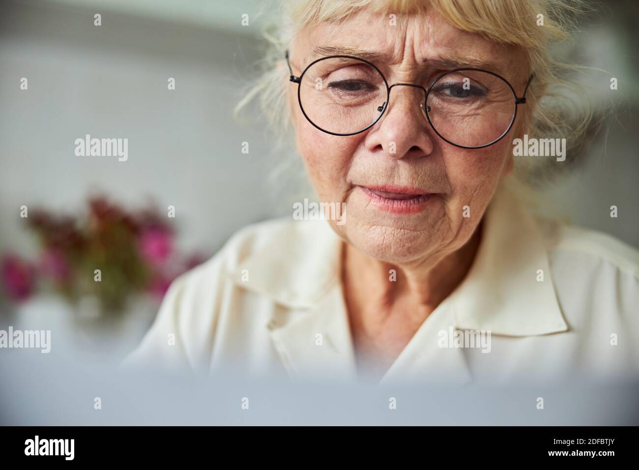 Lovely old woman with wrinkled skin wearing round glasses Stock Photo ... Lovely old woman with wrinkled skin wearing round glasses Stock Photo ...