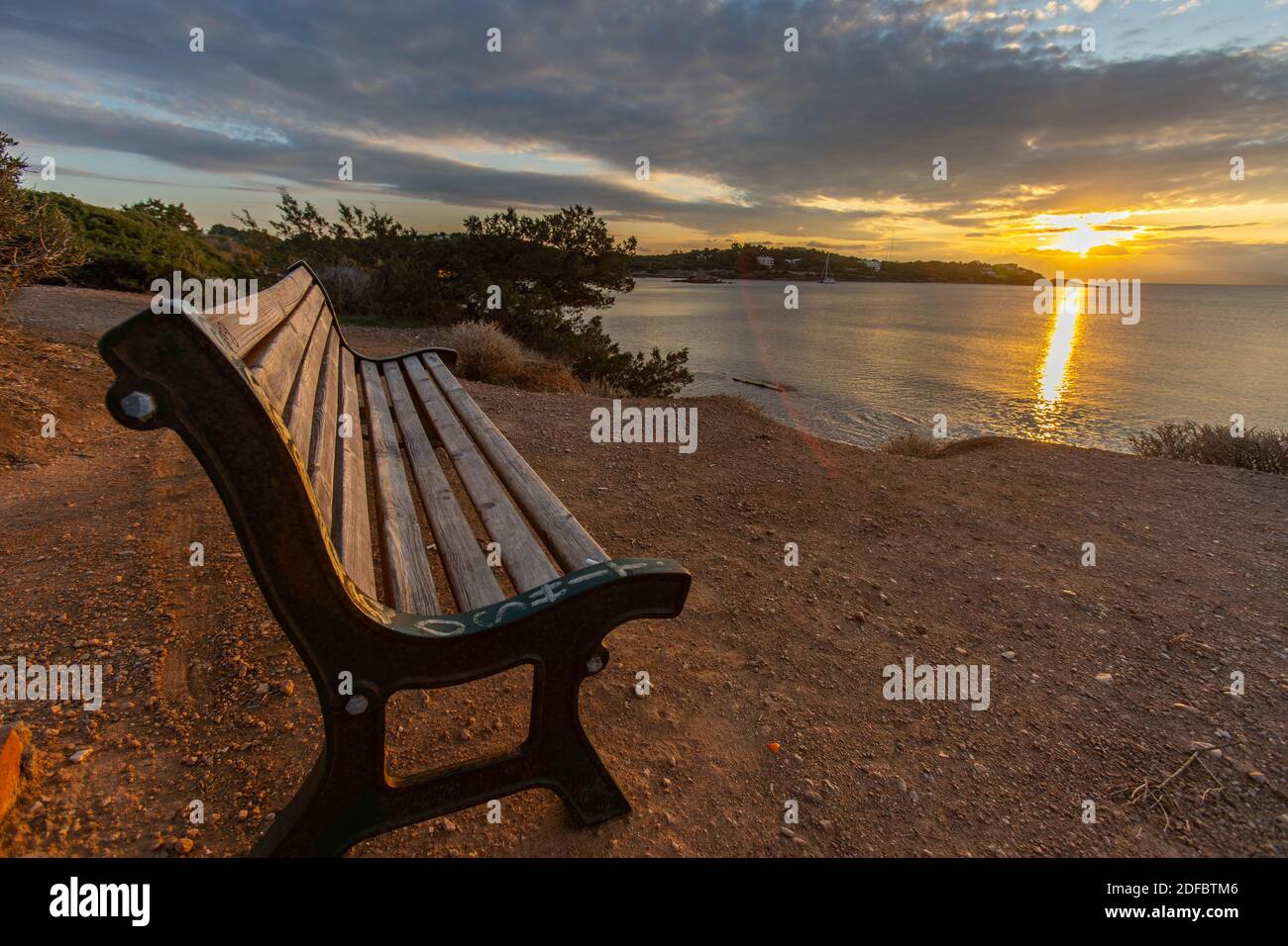 A bench near the sea during sunset,at Greece Stock Photo - Alamy