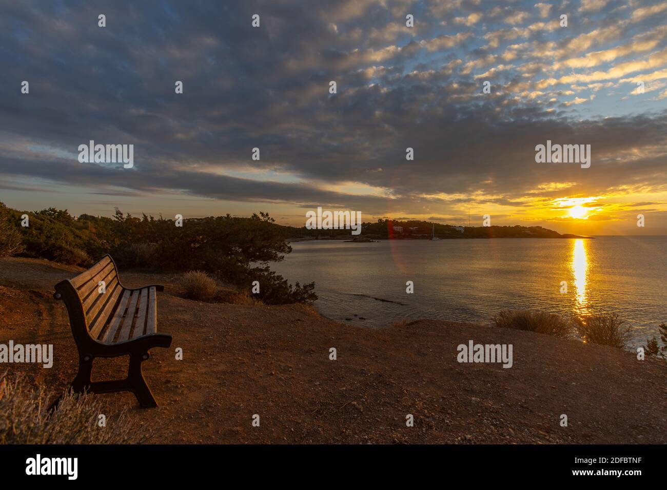 A bench near the sea during sunset,at Greece Stock Photo - Alamy