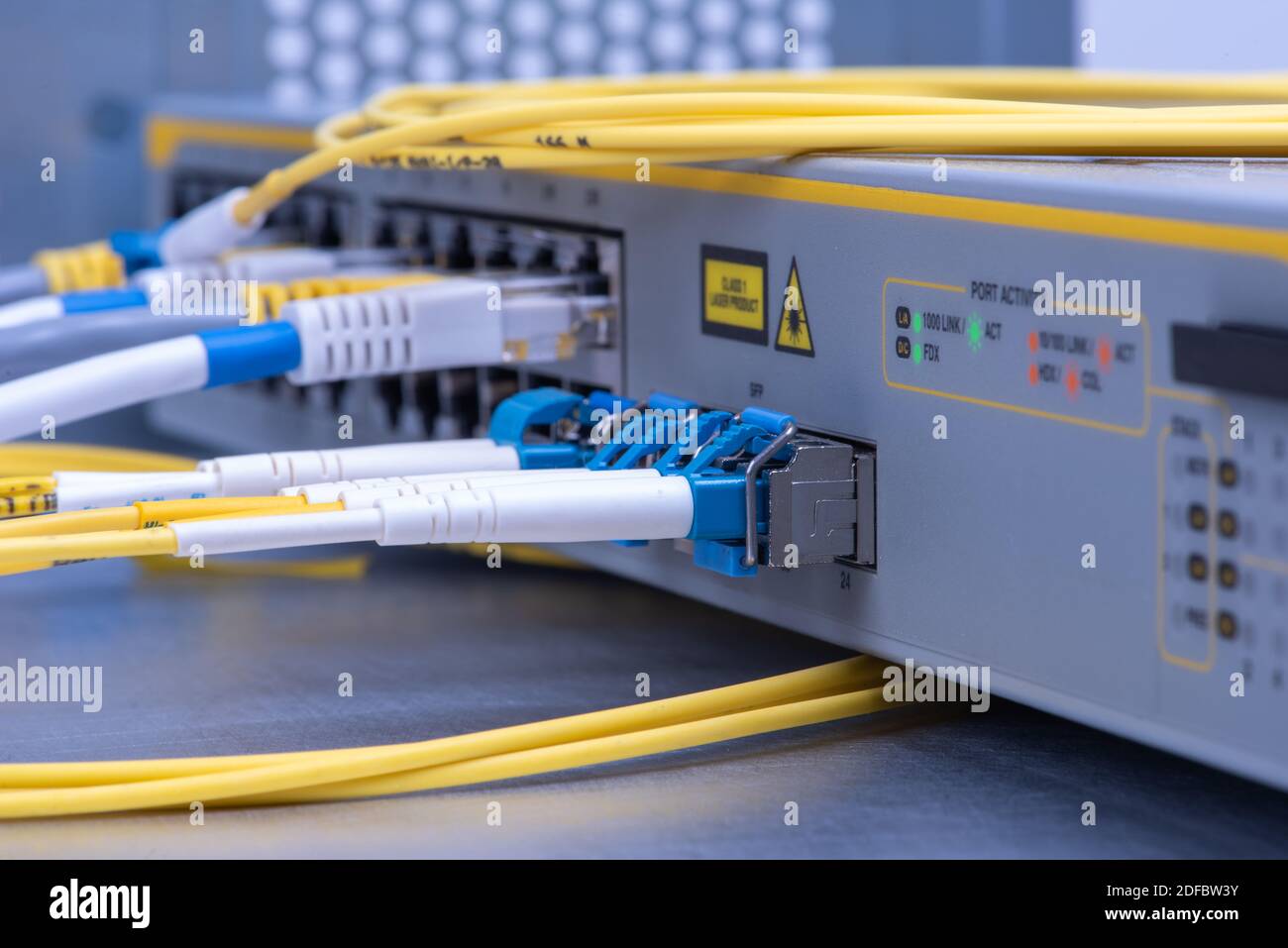 Network Equipment Switch With Network Ethernet And Optical Cables Stock